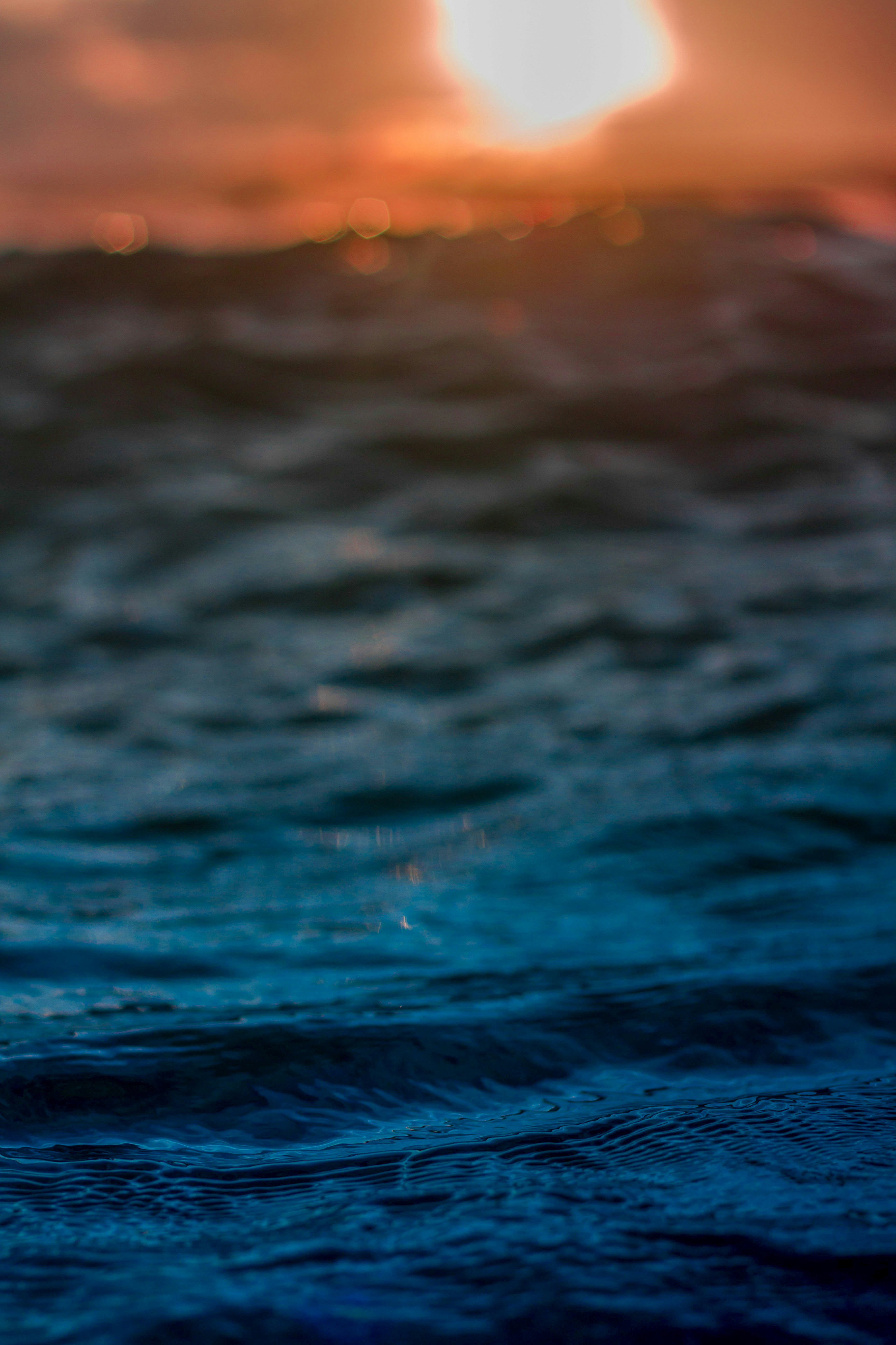 Blue water under yellow sun photo – Free Malé Image on Unsplash