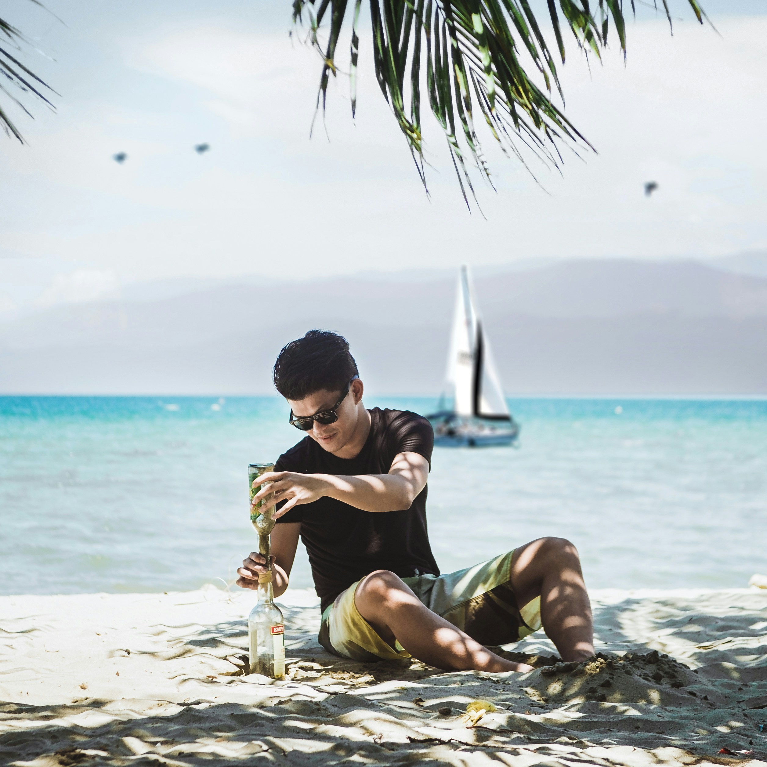 Sunlit Sand Sipper: A Beachside Moment in Focus