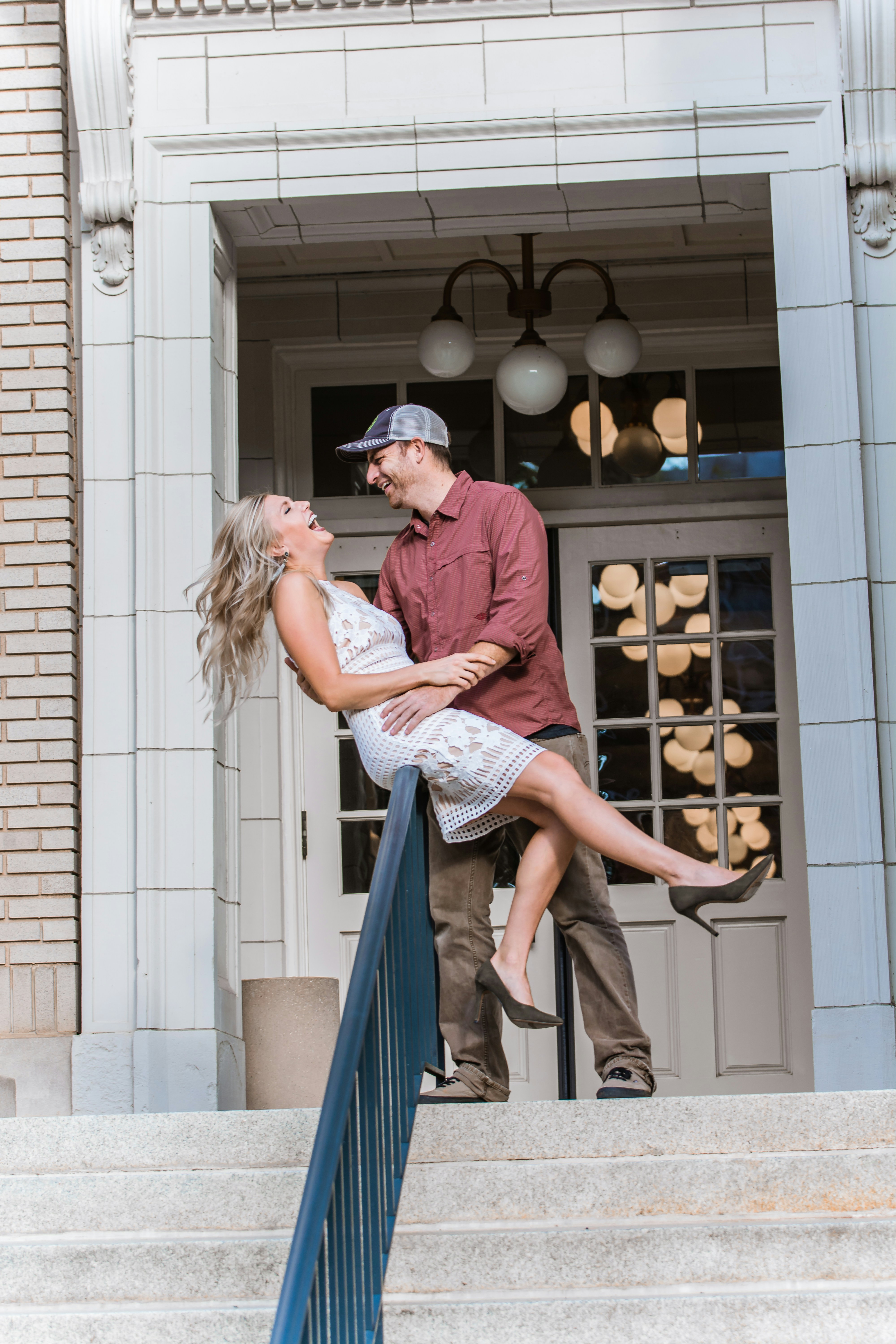 Laughter on the Staircase: A Couple's Playful Lift