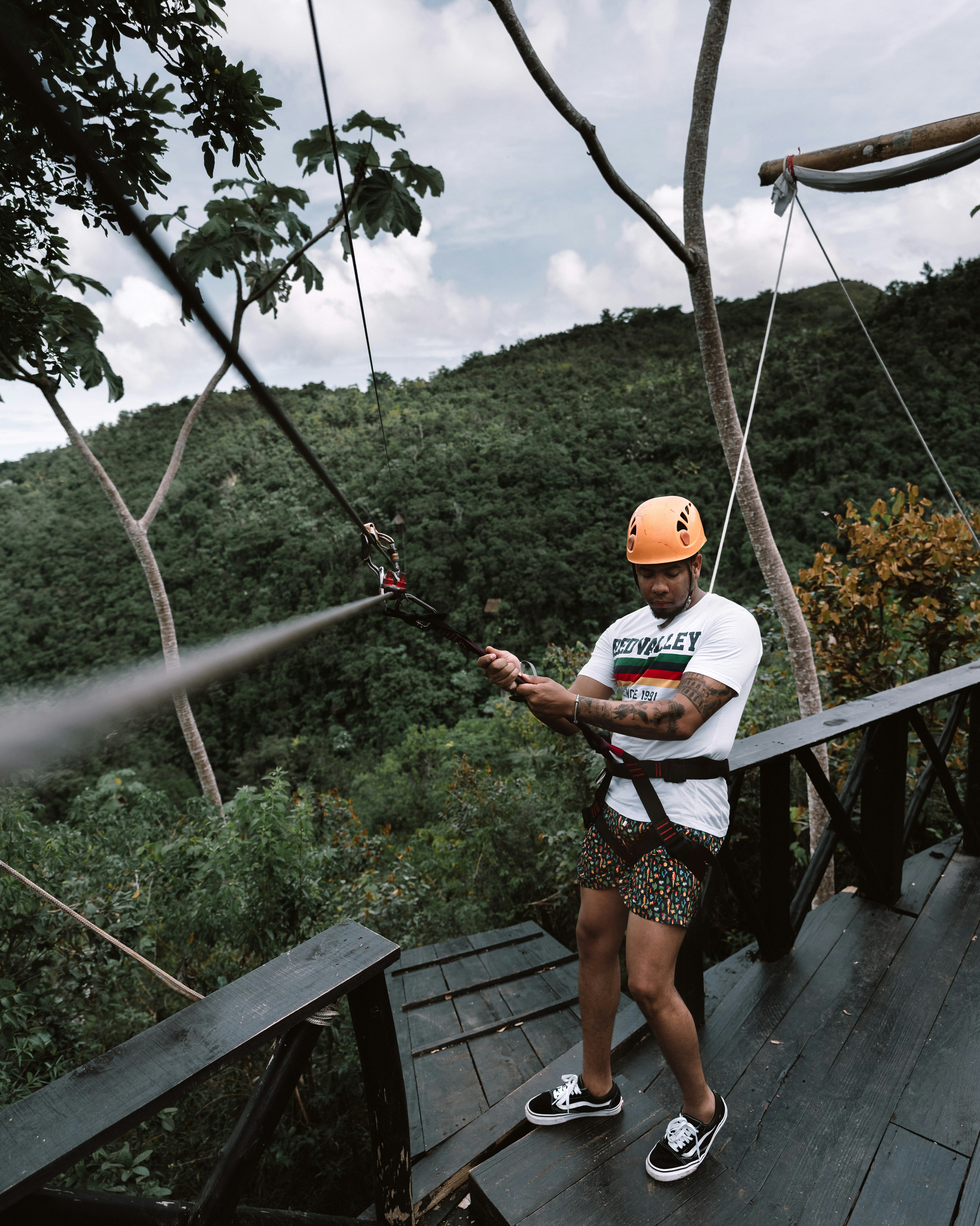 Man standing on black stair holding zipline photo – Free Samaná ...