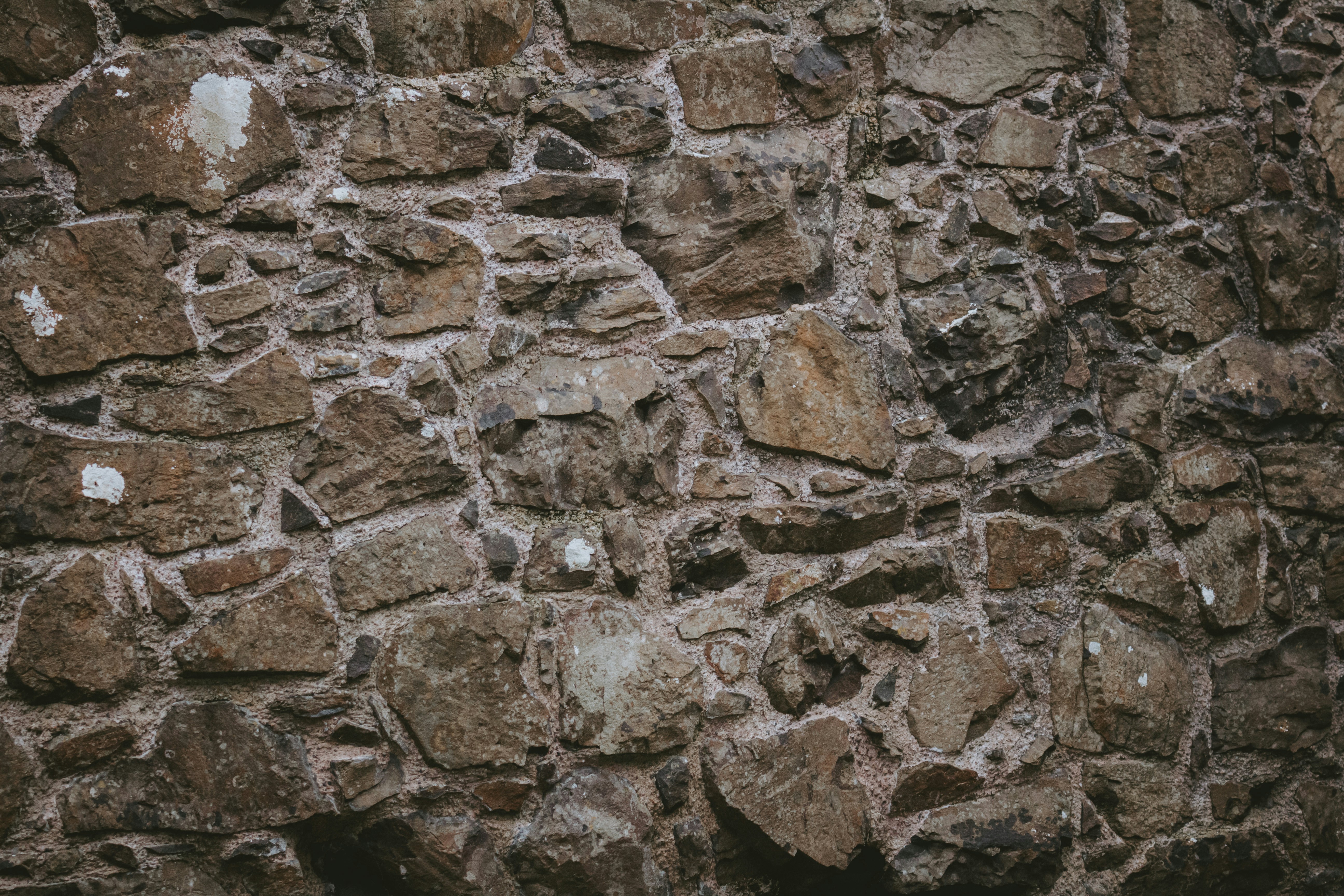 Foto Un primer plano de un muro de piedra hecho de rocas – Imagen ...