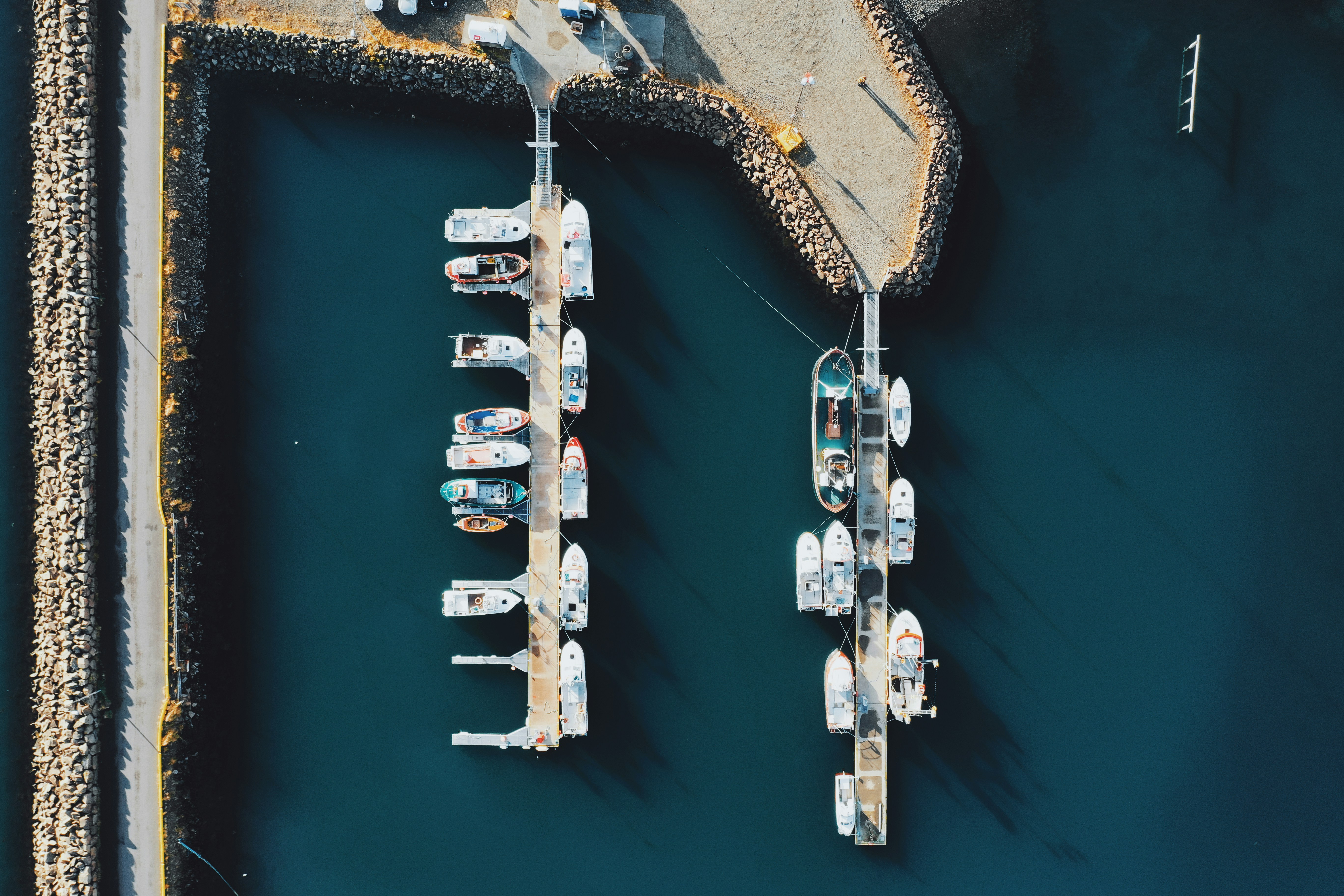 Boats beside docks photo – Free Snow Image on Unsplash