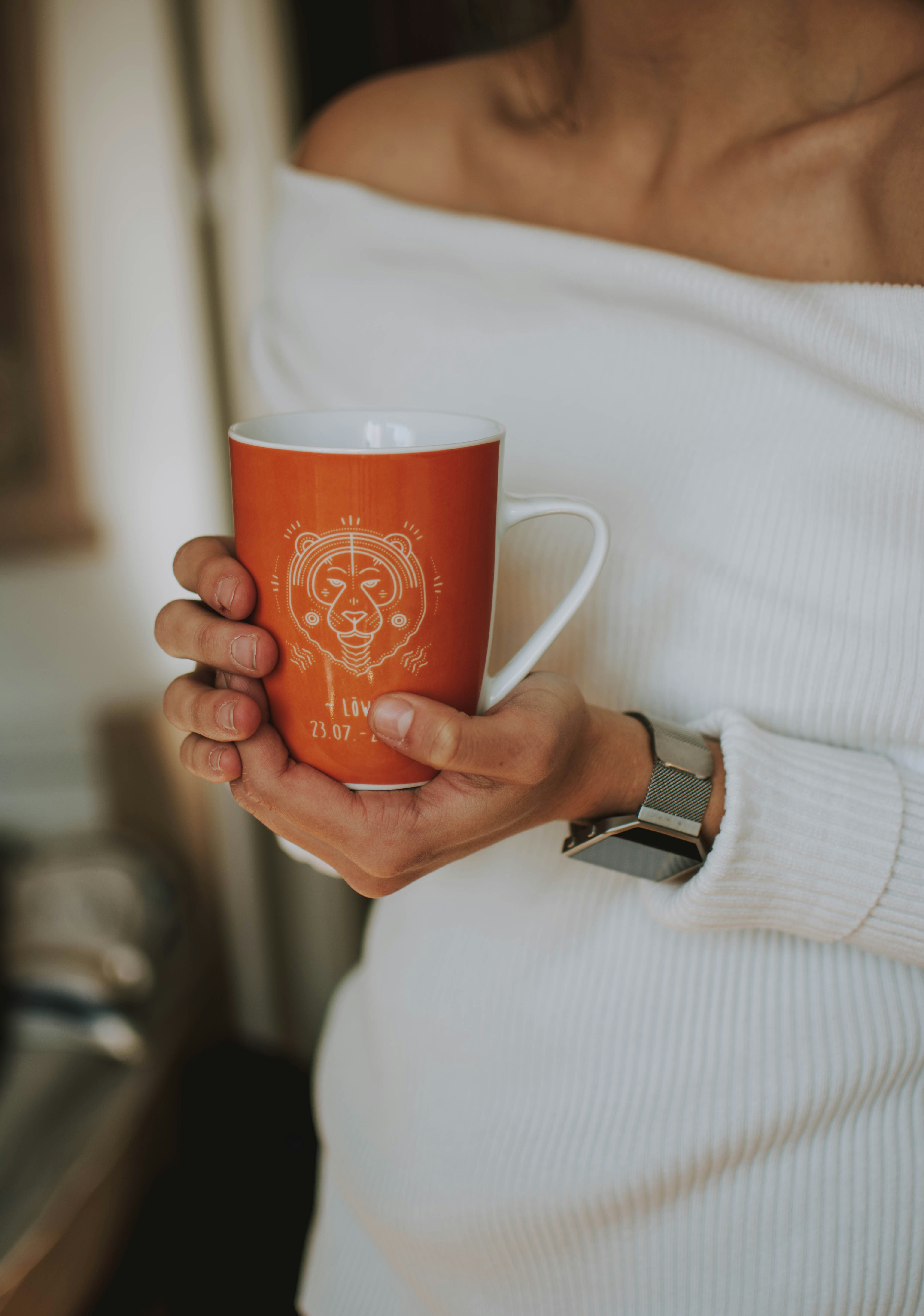 Panda Emblem in a Warm Orange Mug: Quiet Morning Moment