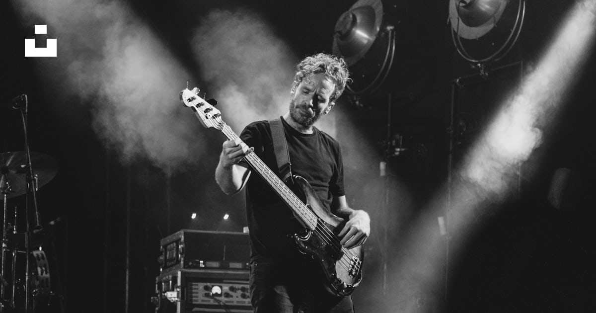 Grayscale Photo Of Man Playing Bass Guitar Photo Free Grey Image On