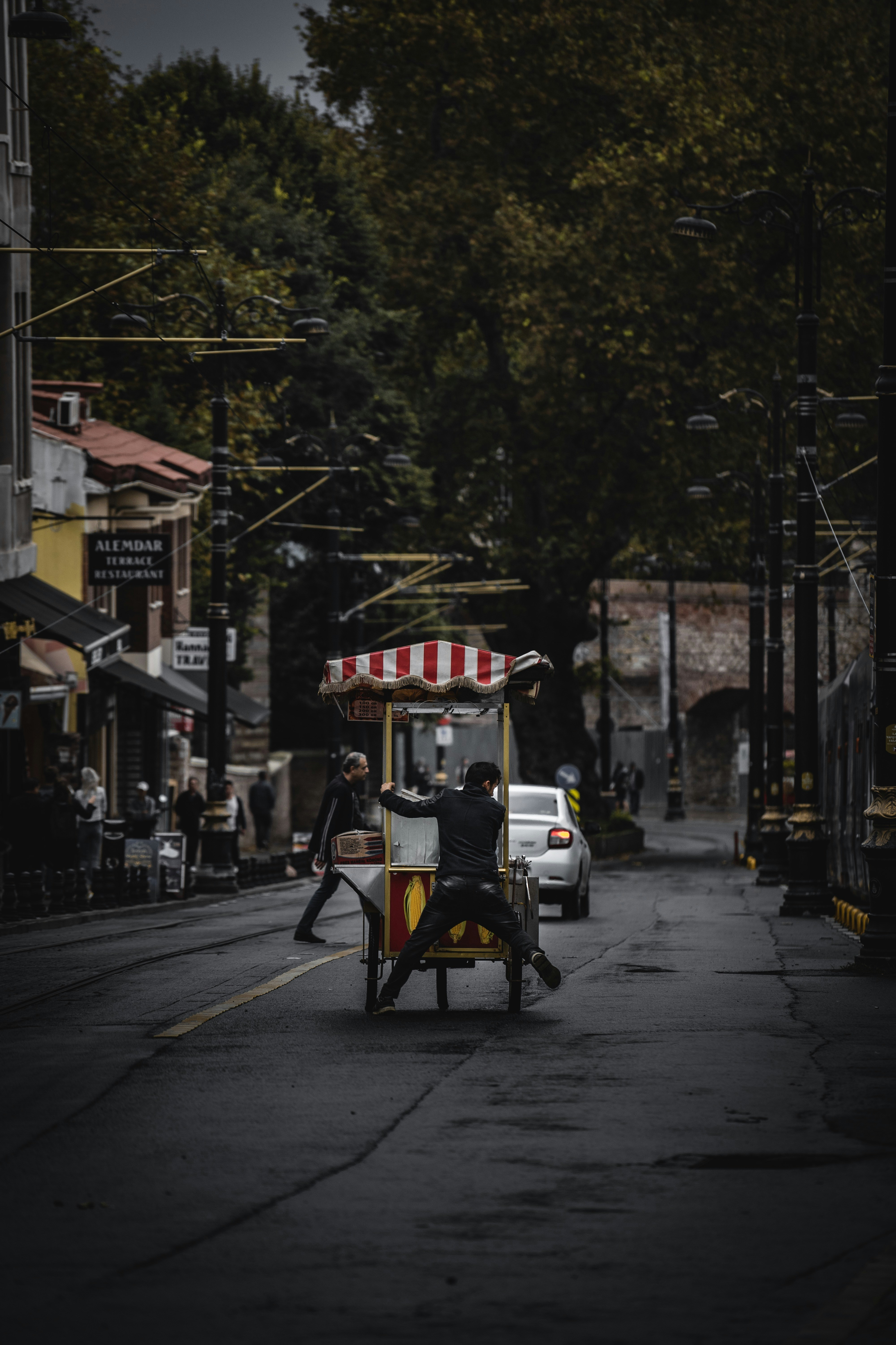 Man pulling food cart in the middle of road photo – Free Turkey Image ...