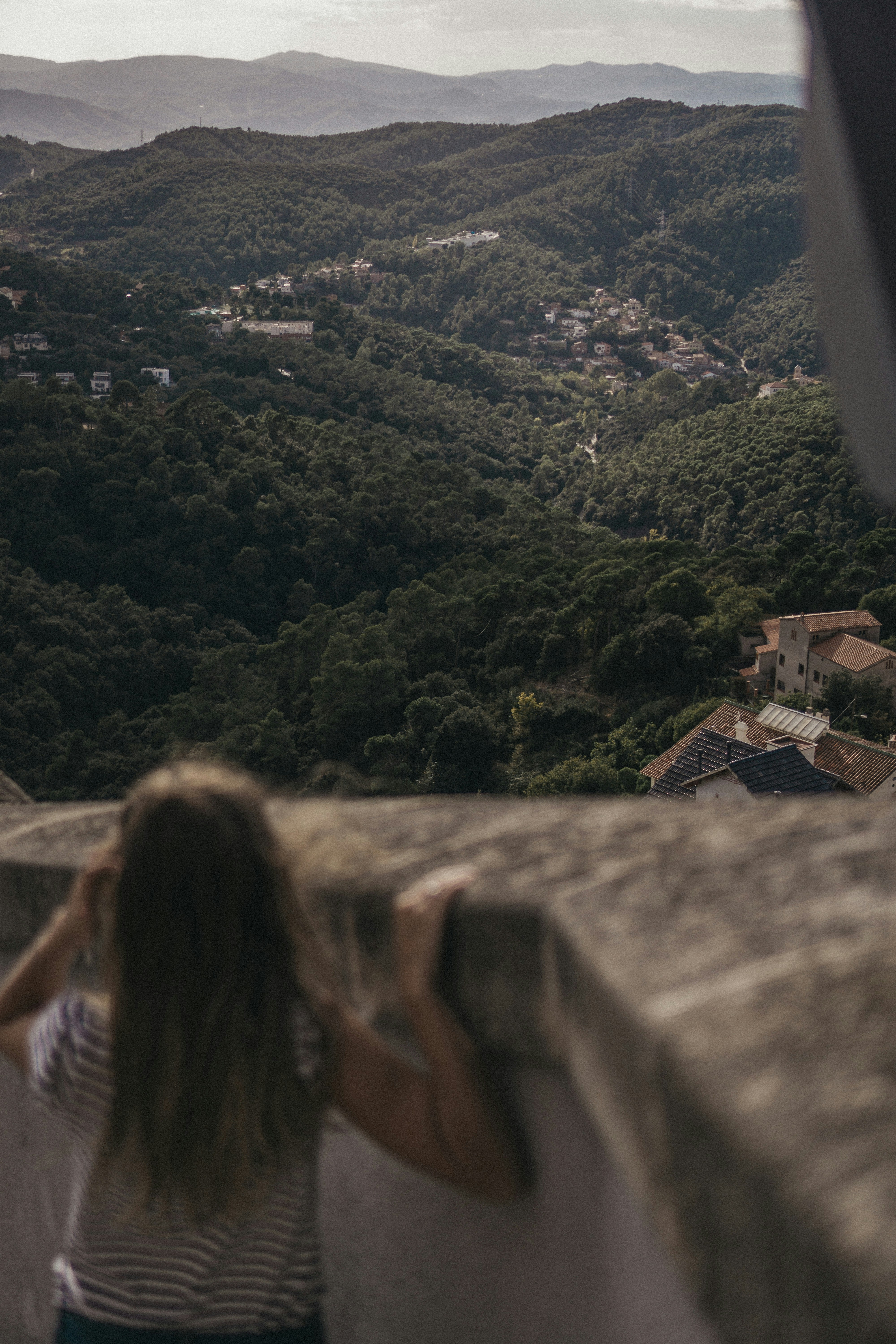 Girl standing near concrete railings viewing mountain photo – Free ...