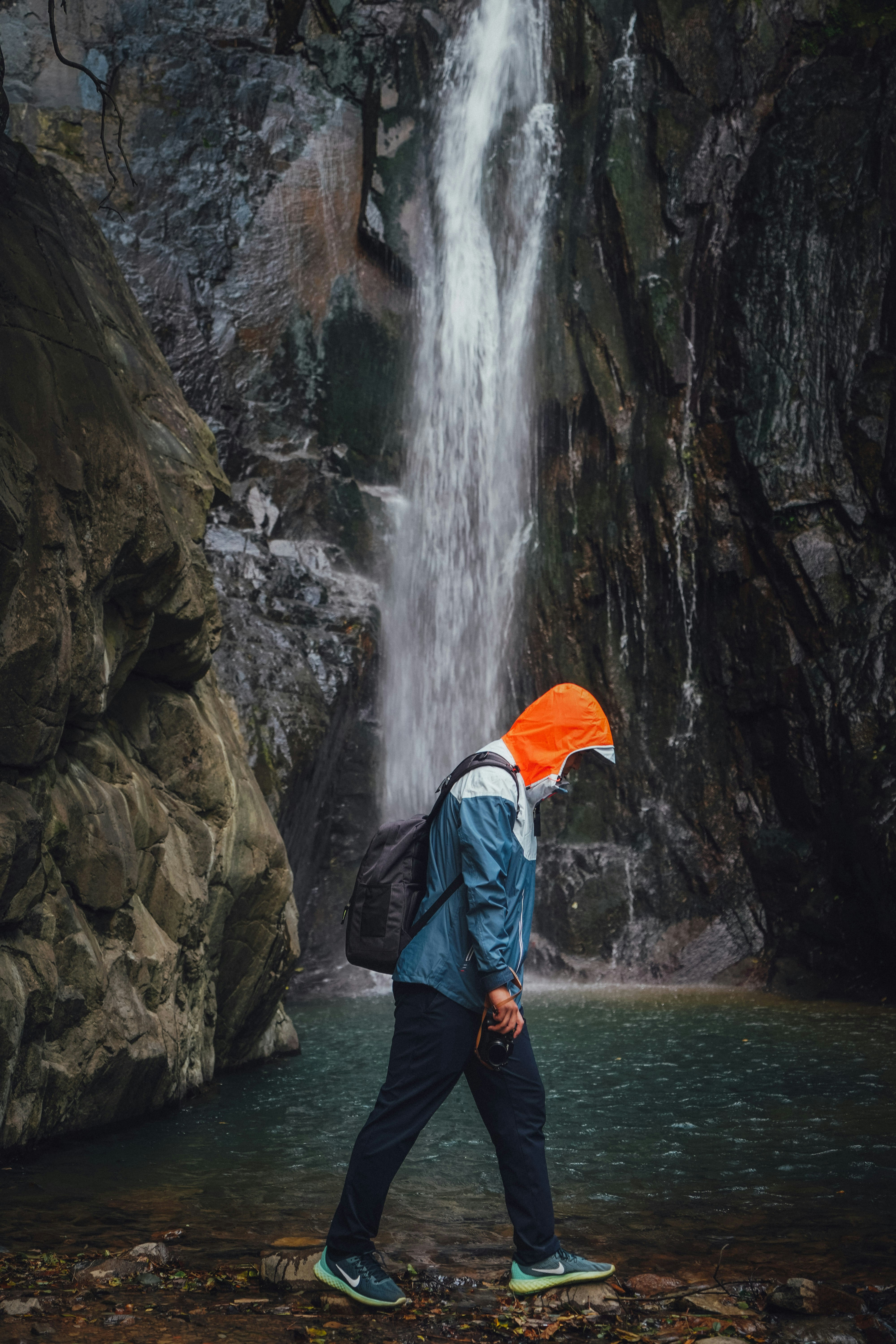 Man walking near waterfalls photo – Free Huzhou Image on Unsplash