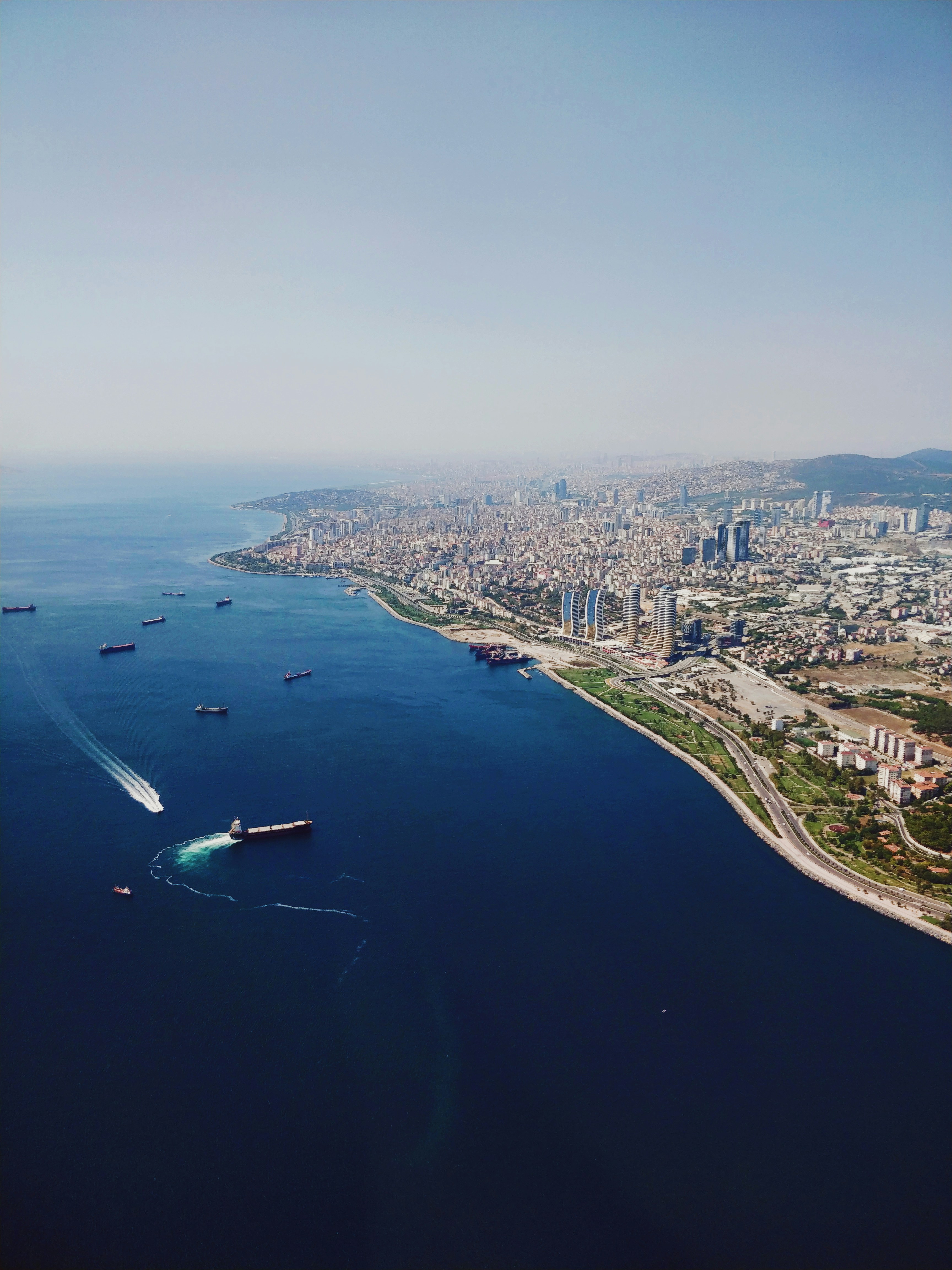 There are hundreds of plane shots in my gallery. It’s like a slideshow when you look through. Obviously my best kind of shots. | aerial photo of city near ocean during daytime