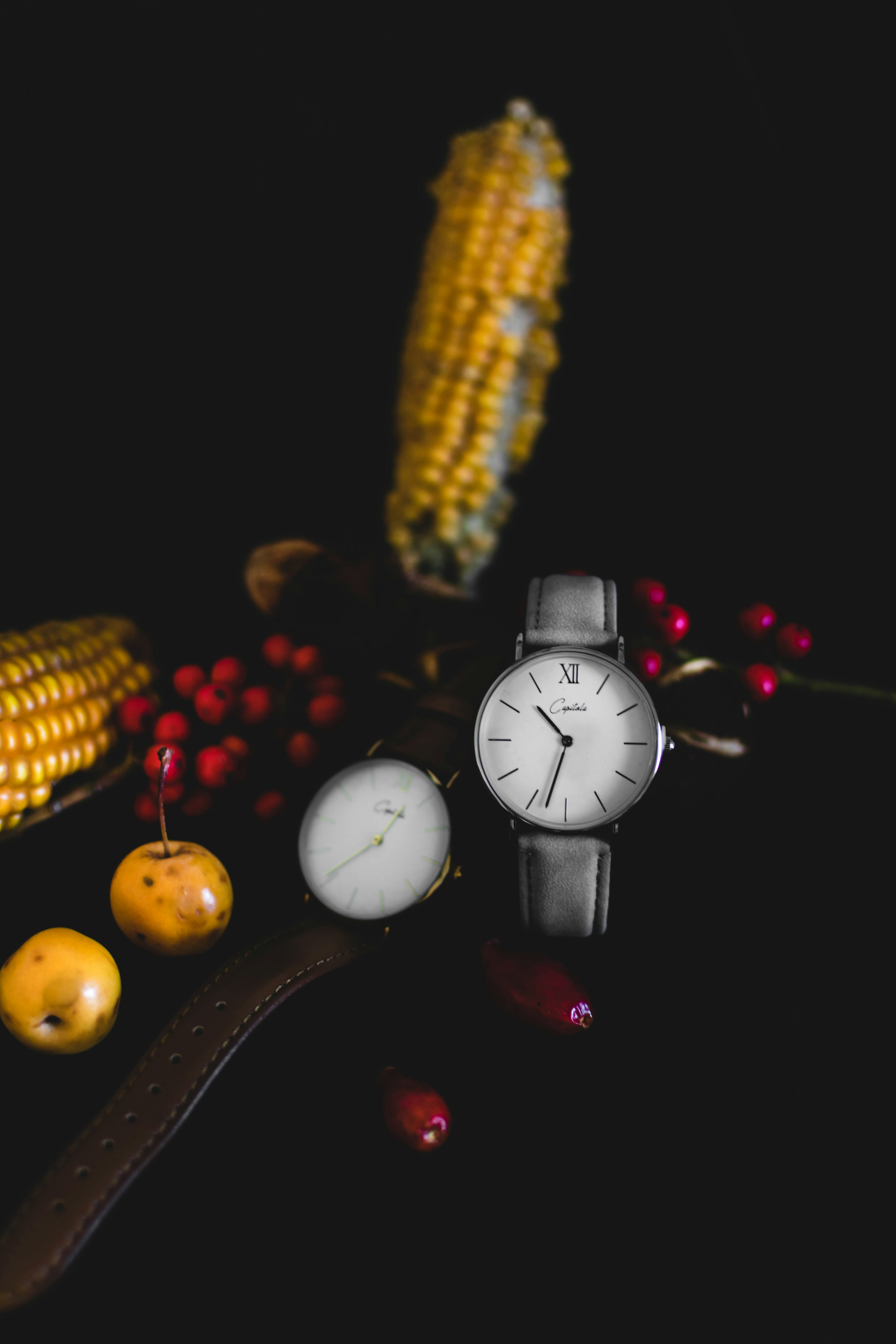 Timeless Minutes: A Quiet Still Life of Timepieces and Harvest