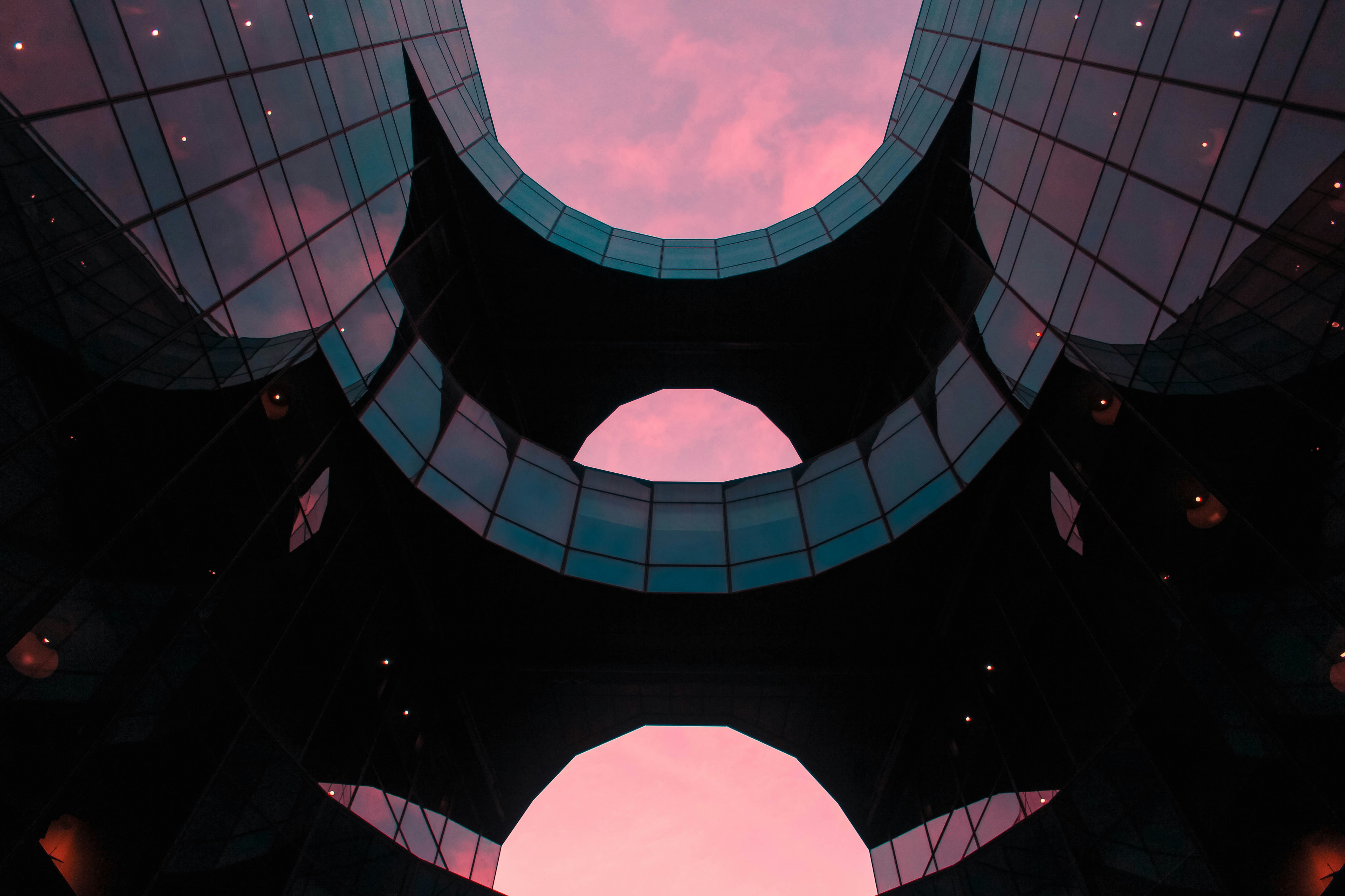 Pink Dusk Framed by Symmetric Glass Arches