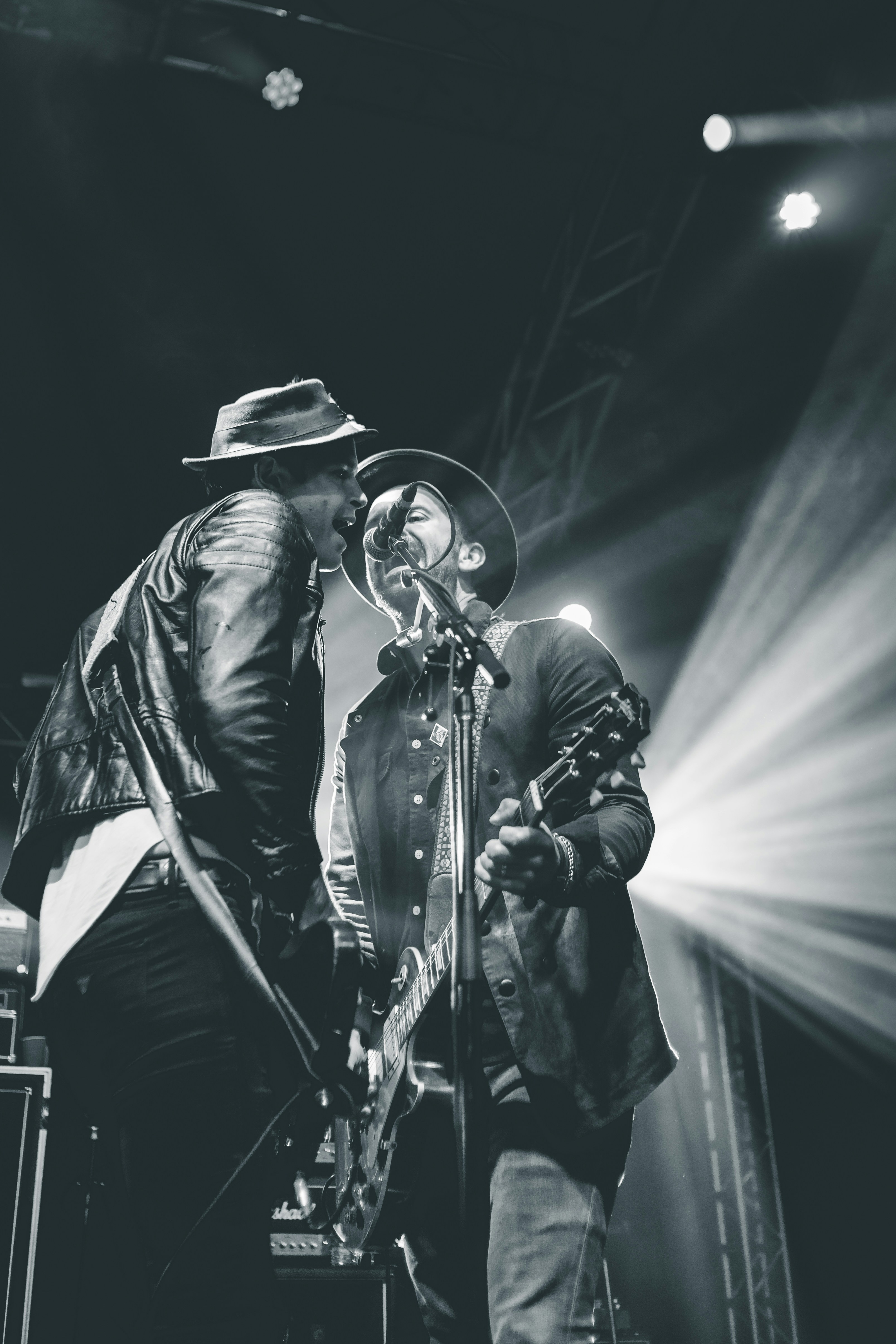 Two men singing on stage photo – Free Grey Image on Unsplash