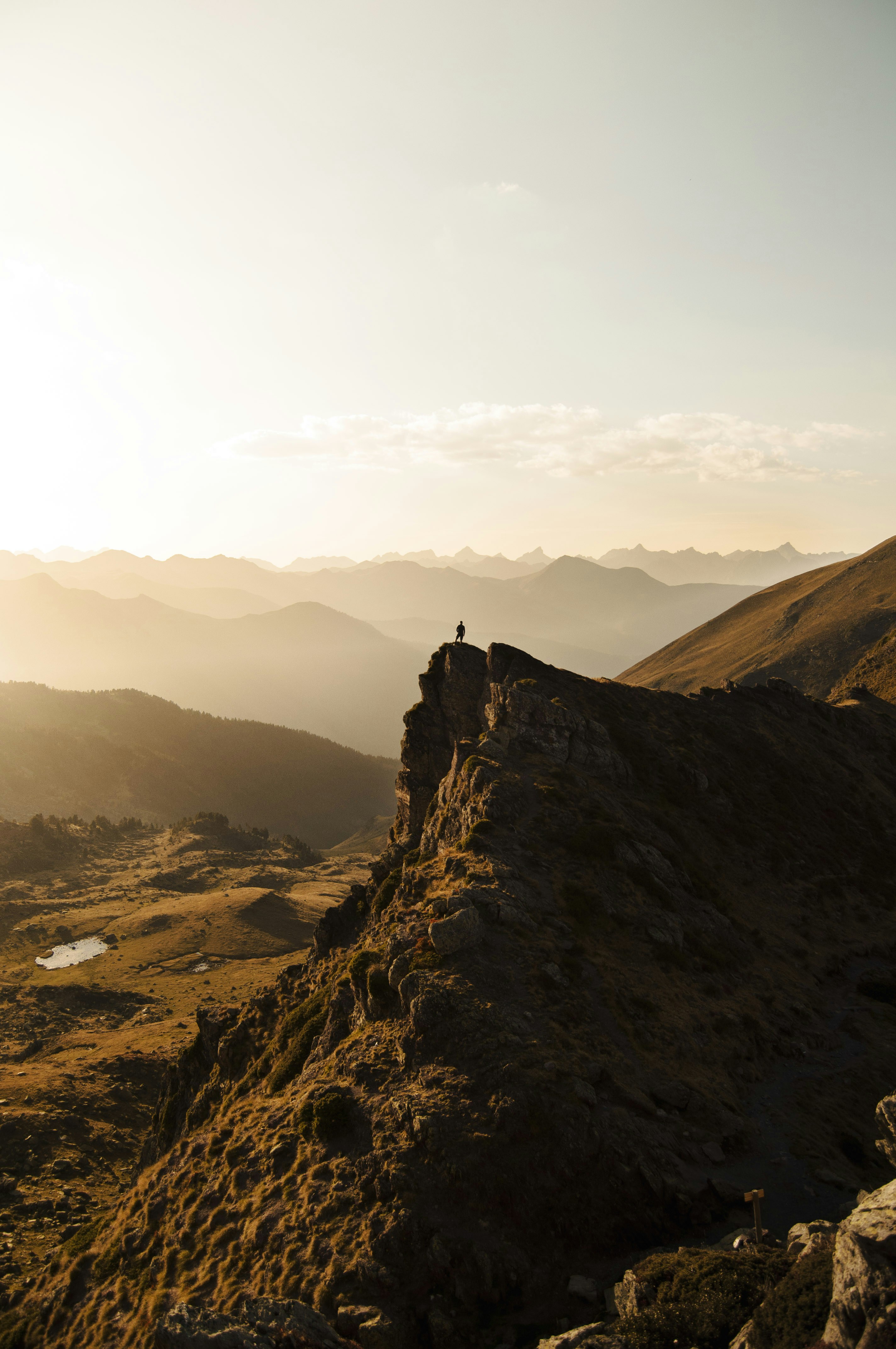 Person on hill photo – Free Pyrenees Image on Unsplash