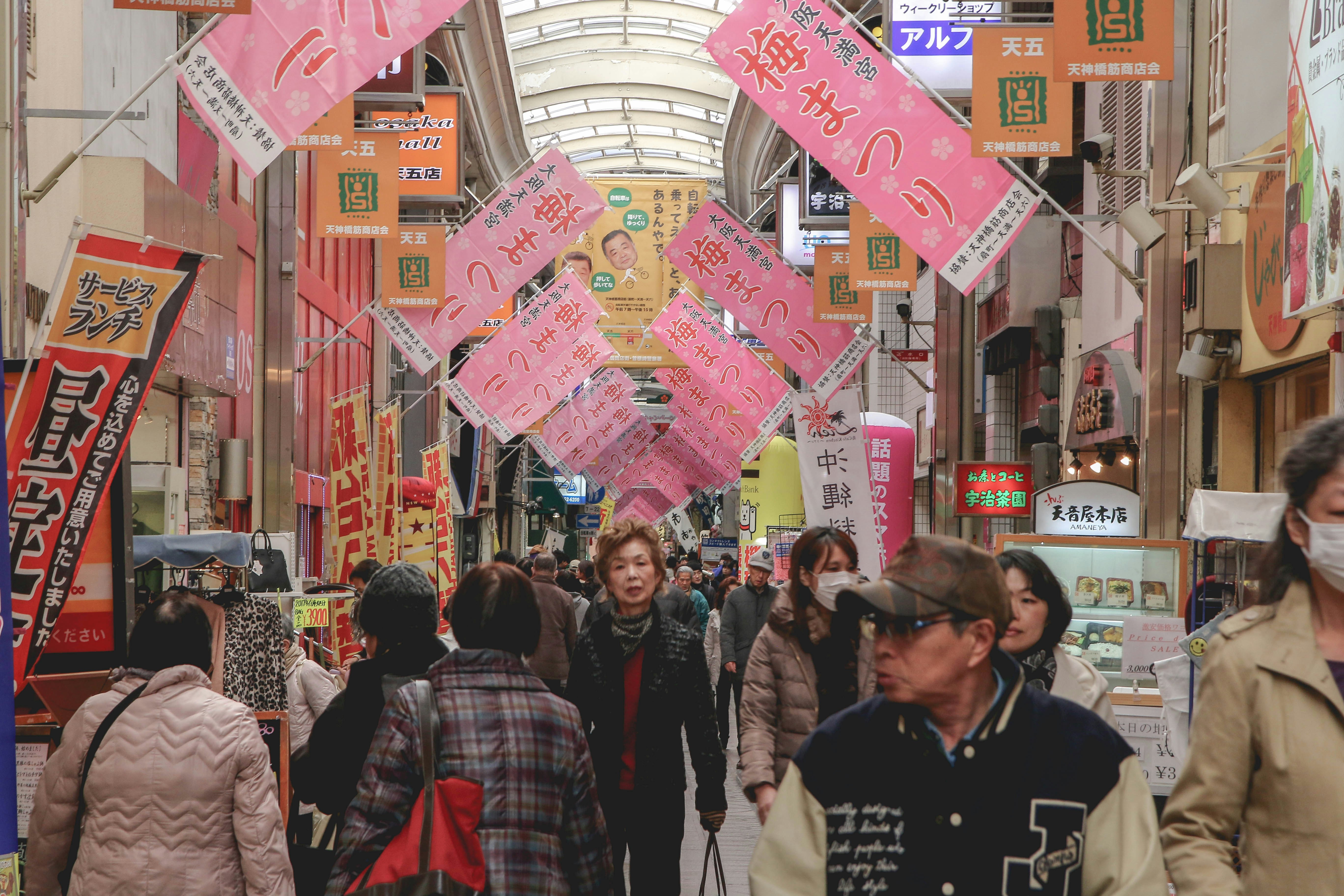 Pink Banner Cathedral Over a Bustling Indoor Market Street