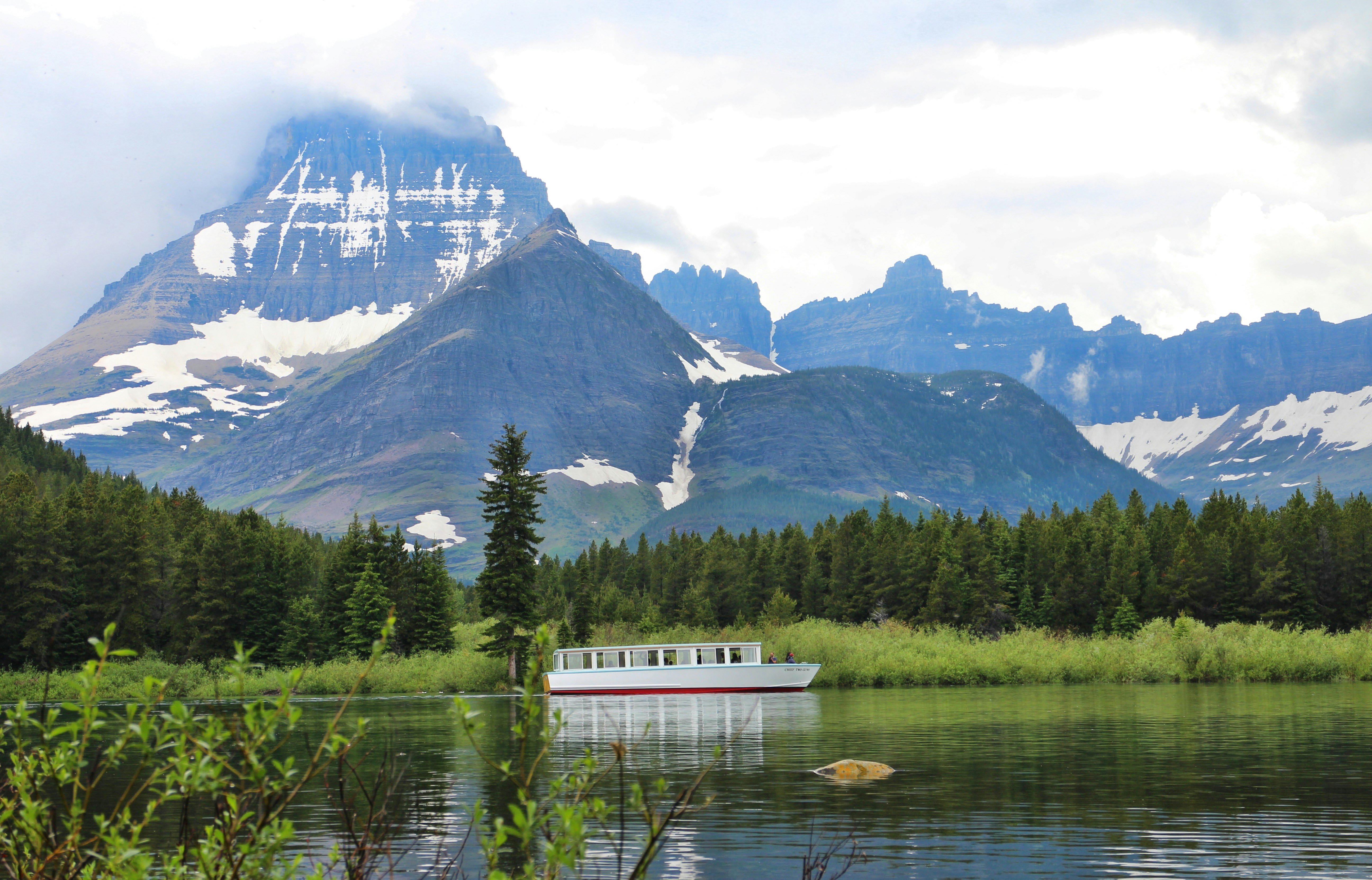 Tour boat Swift current lake | white boat