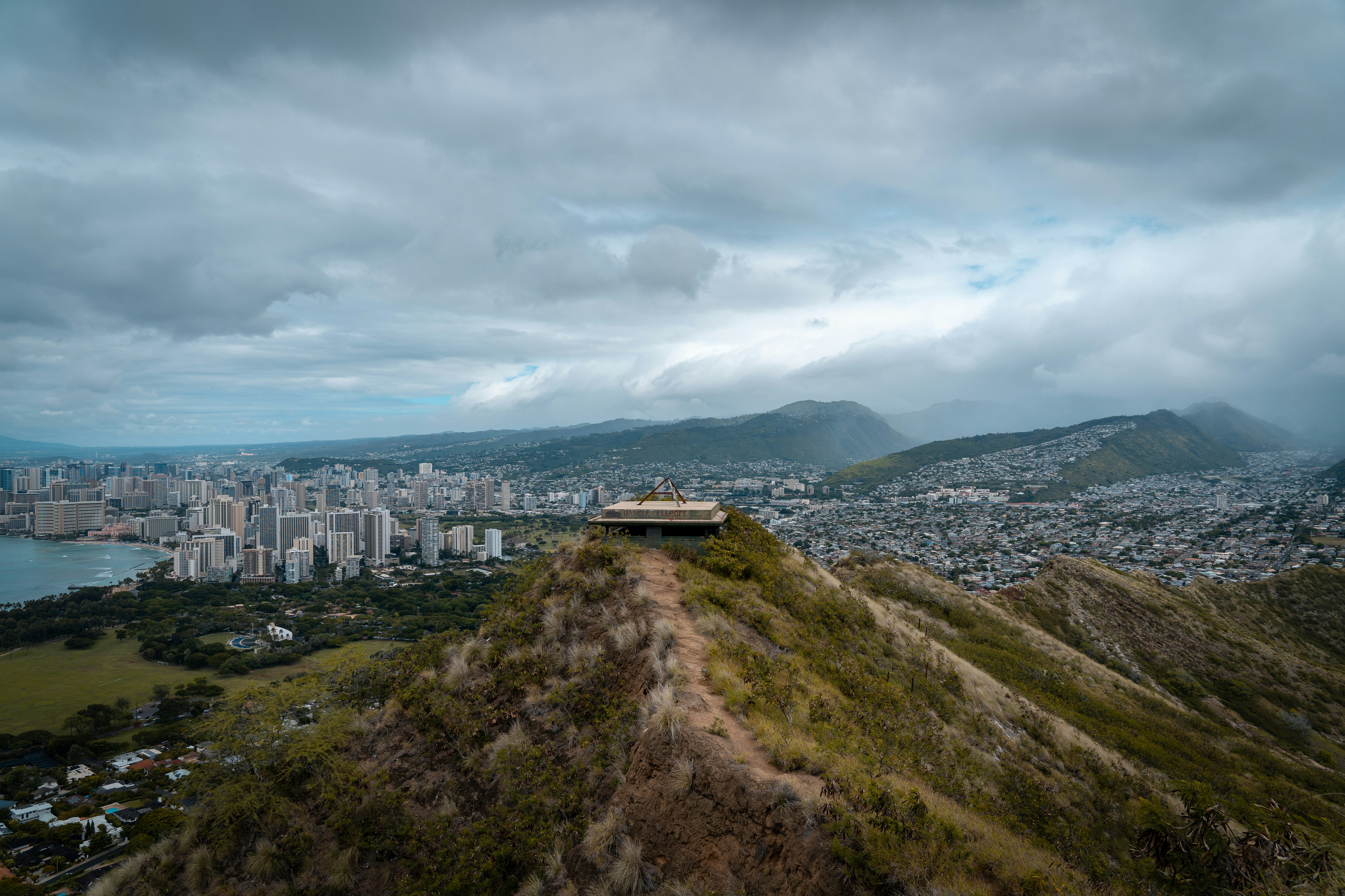 Ridgecrest Lookout Over a Coastal City Beneath Brooding Clouds