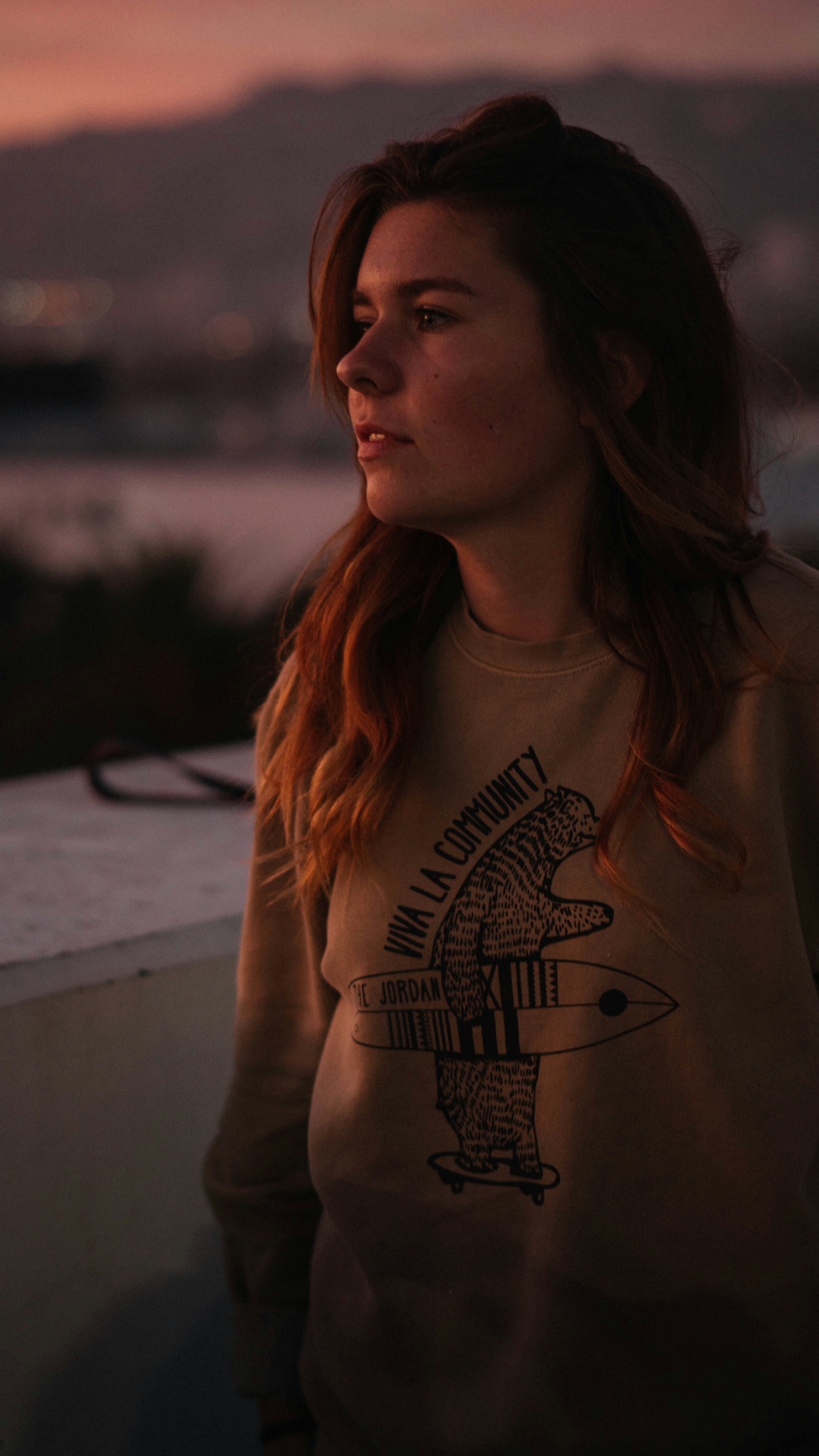 Ember Glow Portrait: A Quiet Dusk Moment in a Surfboard-Bear Hoodie