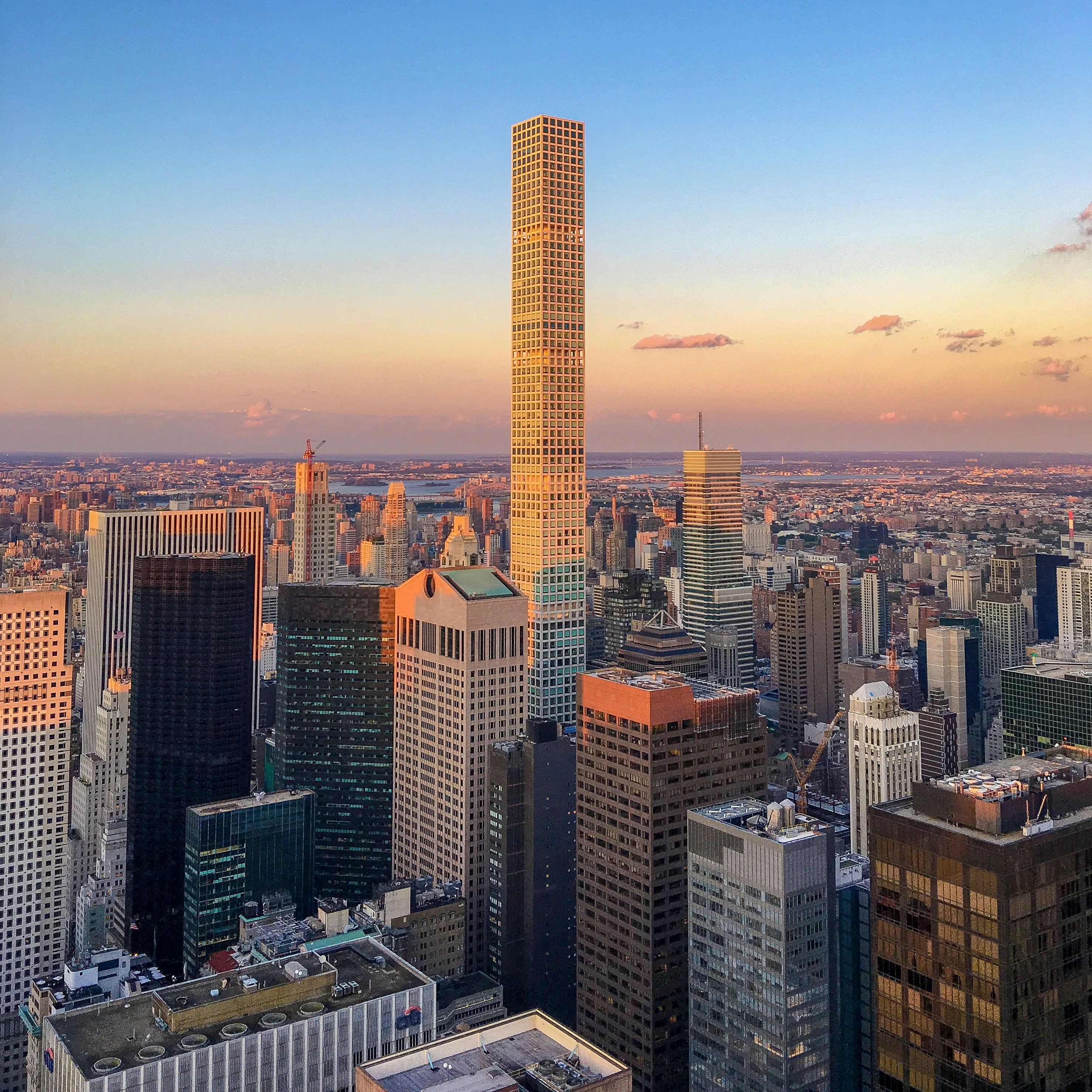 Tallest building in between other high rise building in the city photo ...