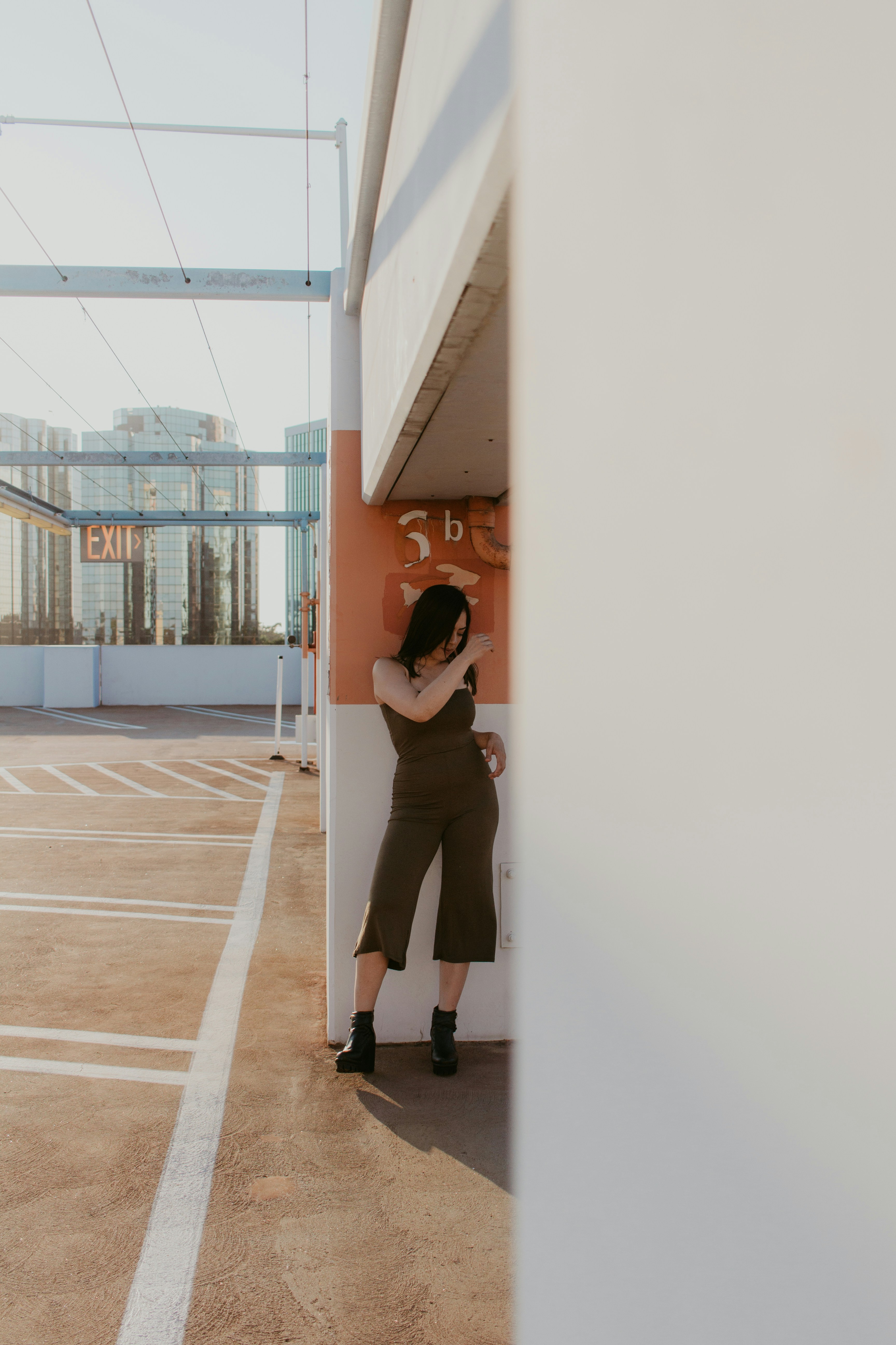 woman leaning on wall