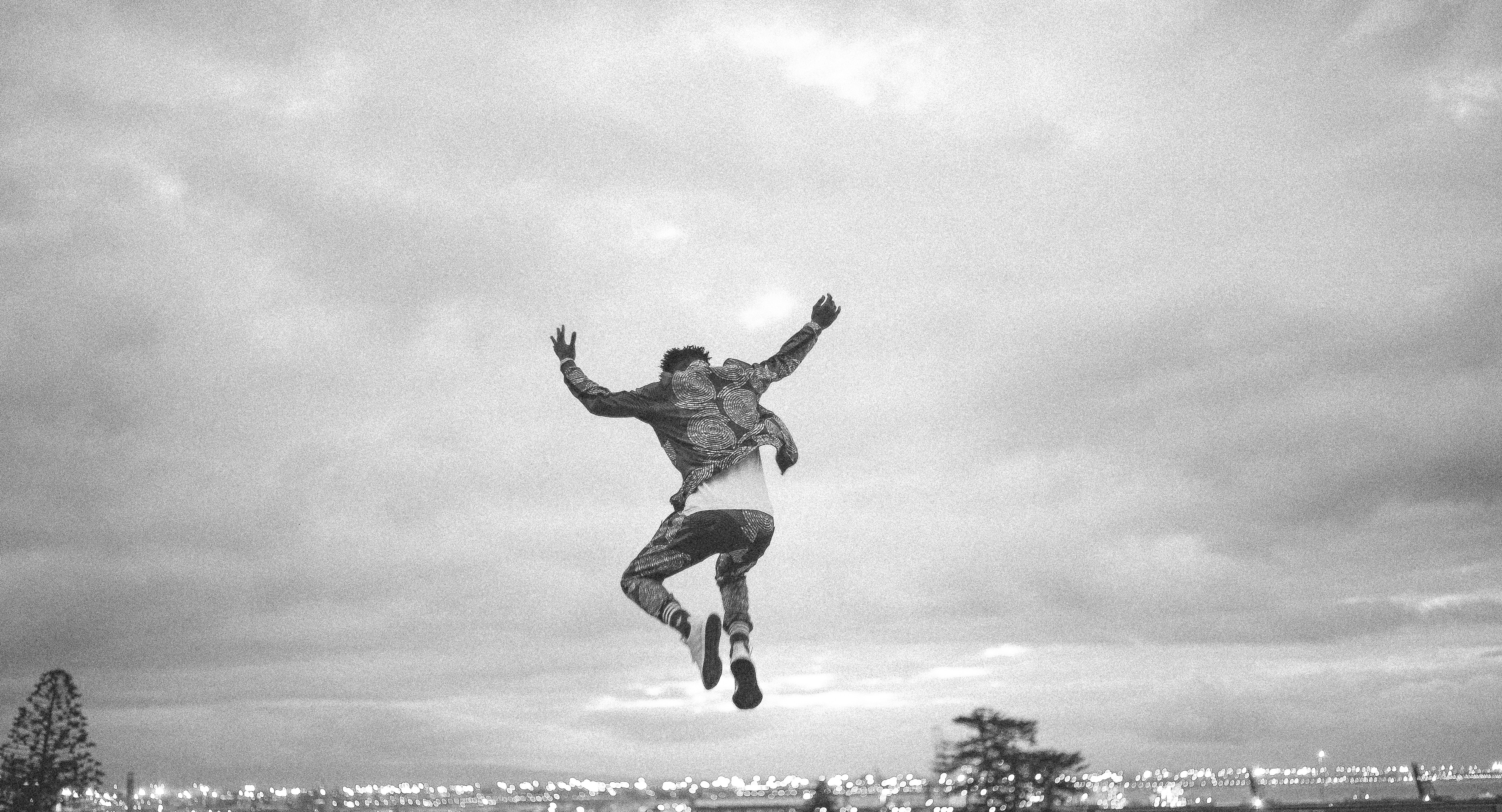 Greyscale photo of person jumping photo – Free Land Image on Unsplash