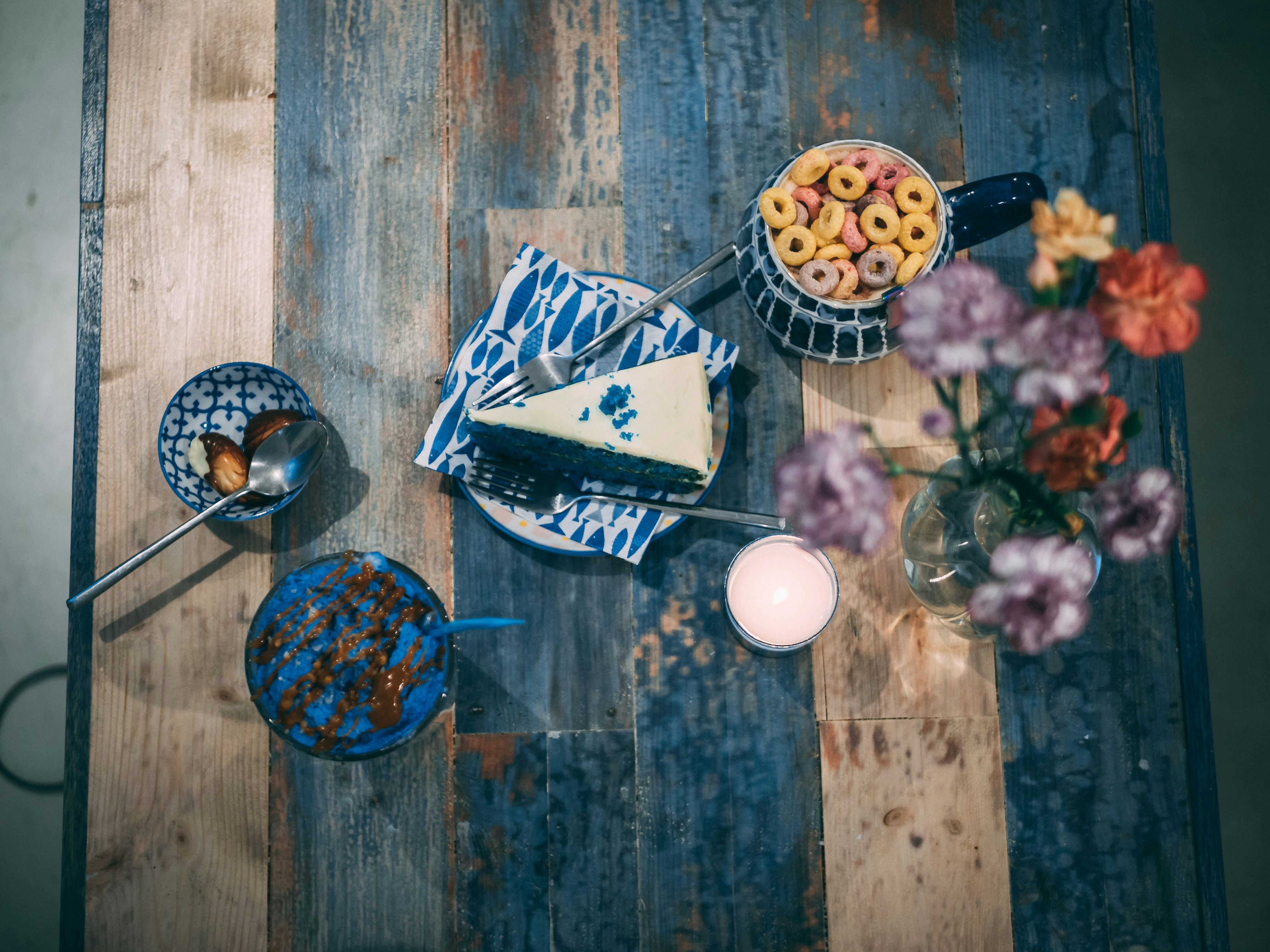 Cerulean Brunch on Weathered Wood: Cake Slice, Cereal Jar, and Violet Florals