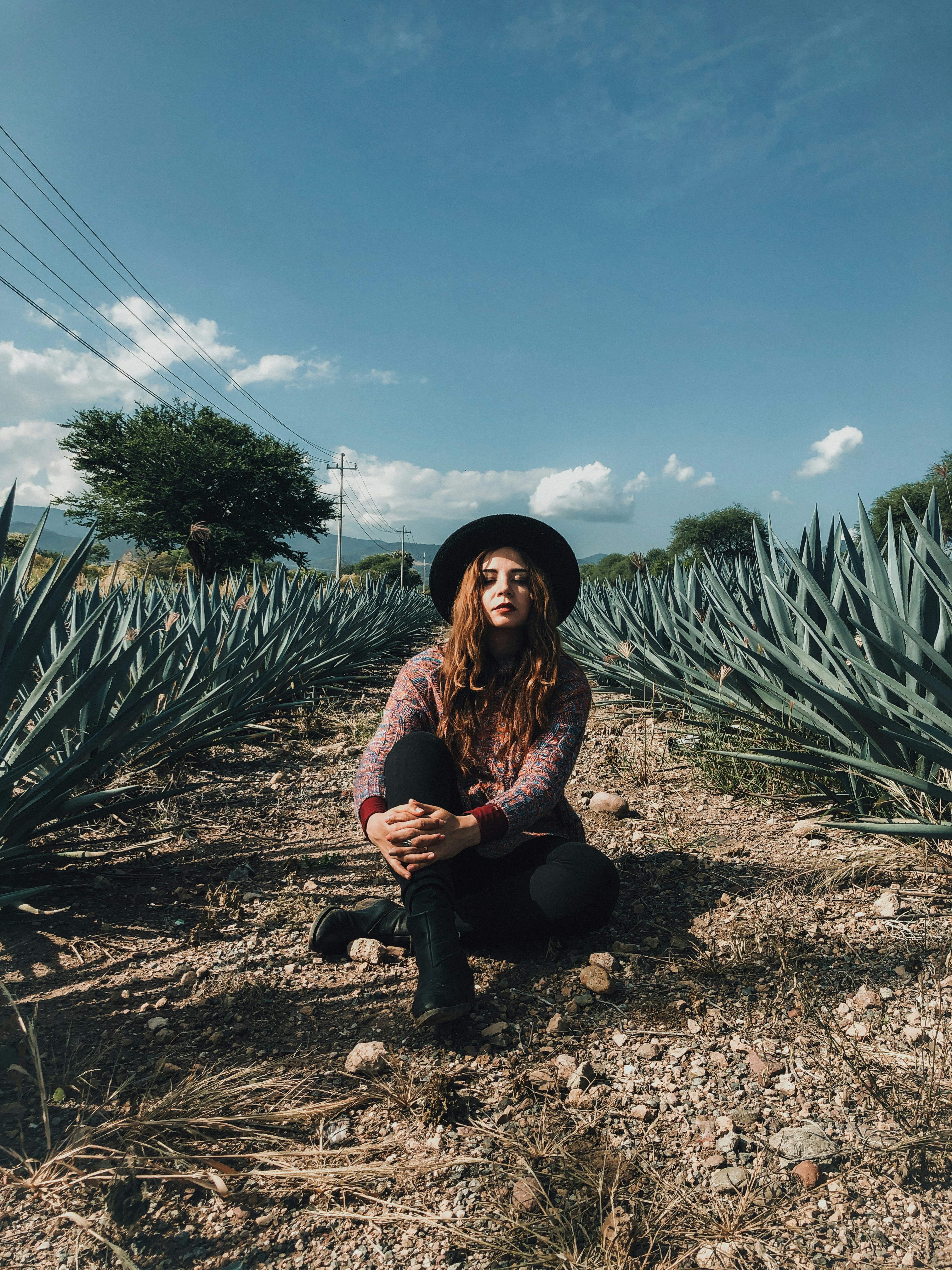Between Spikes and Sky: A Quiet Portrait in an Agave Field