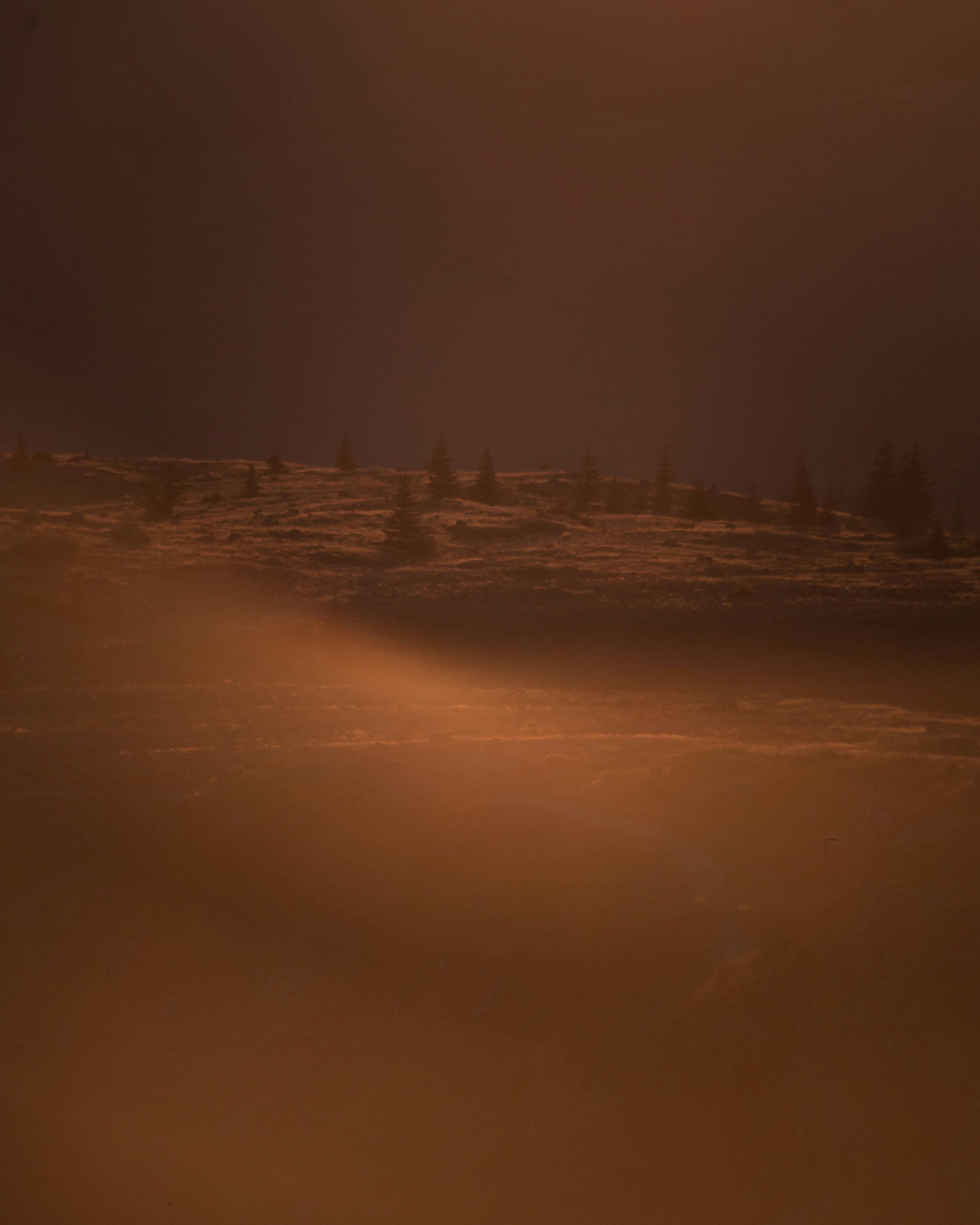 Amber Mist Over a Quiet Tundra