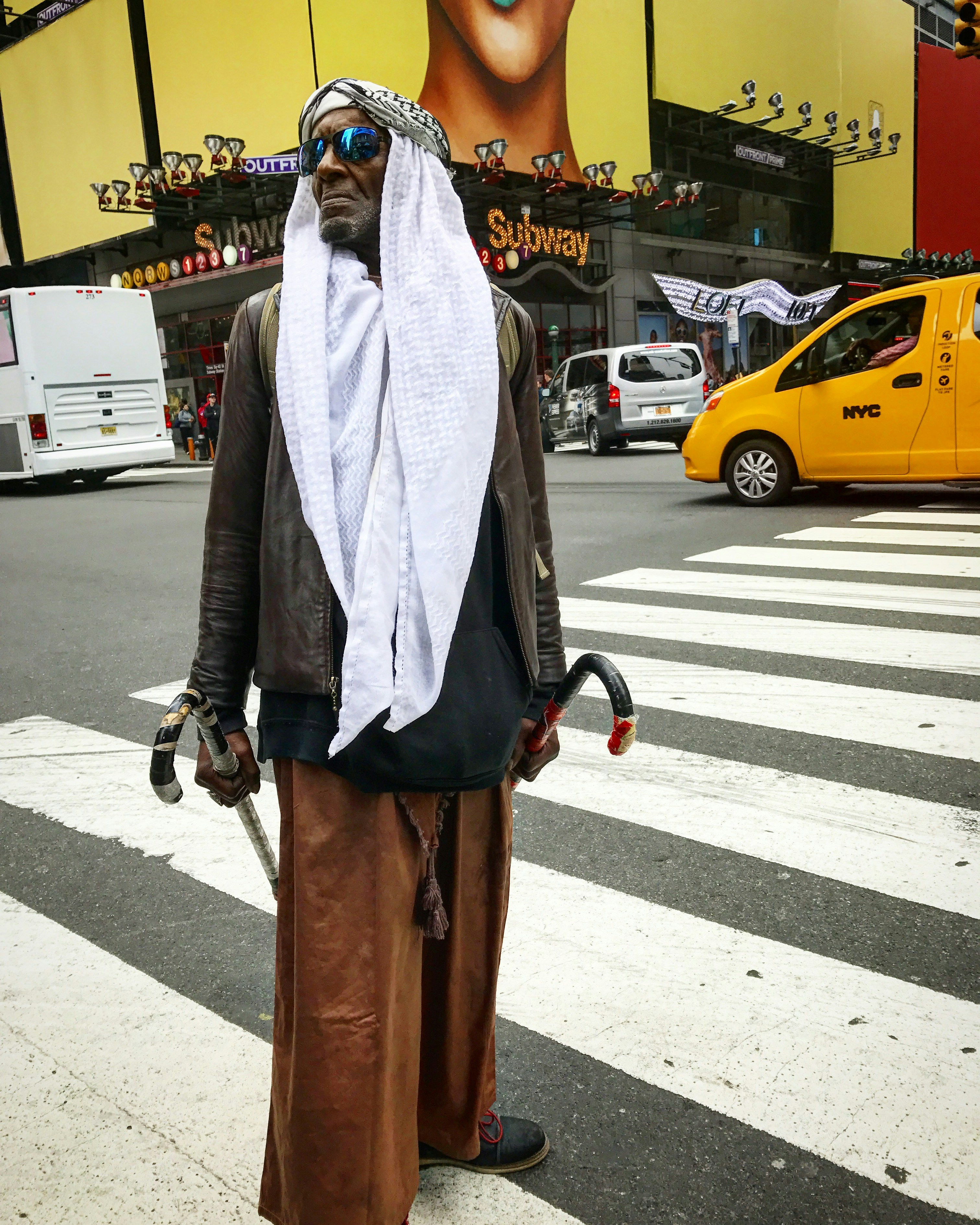 Crosswalk Guardian in Times Square: A Traveler in Traditional Garb