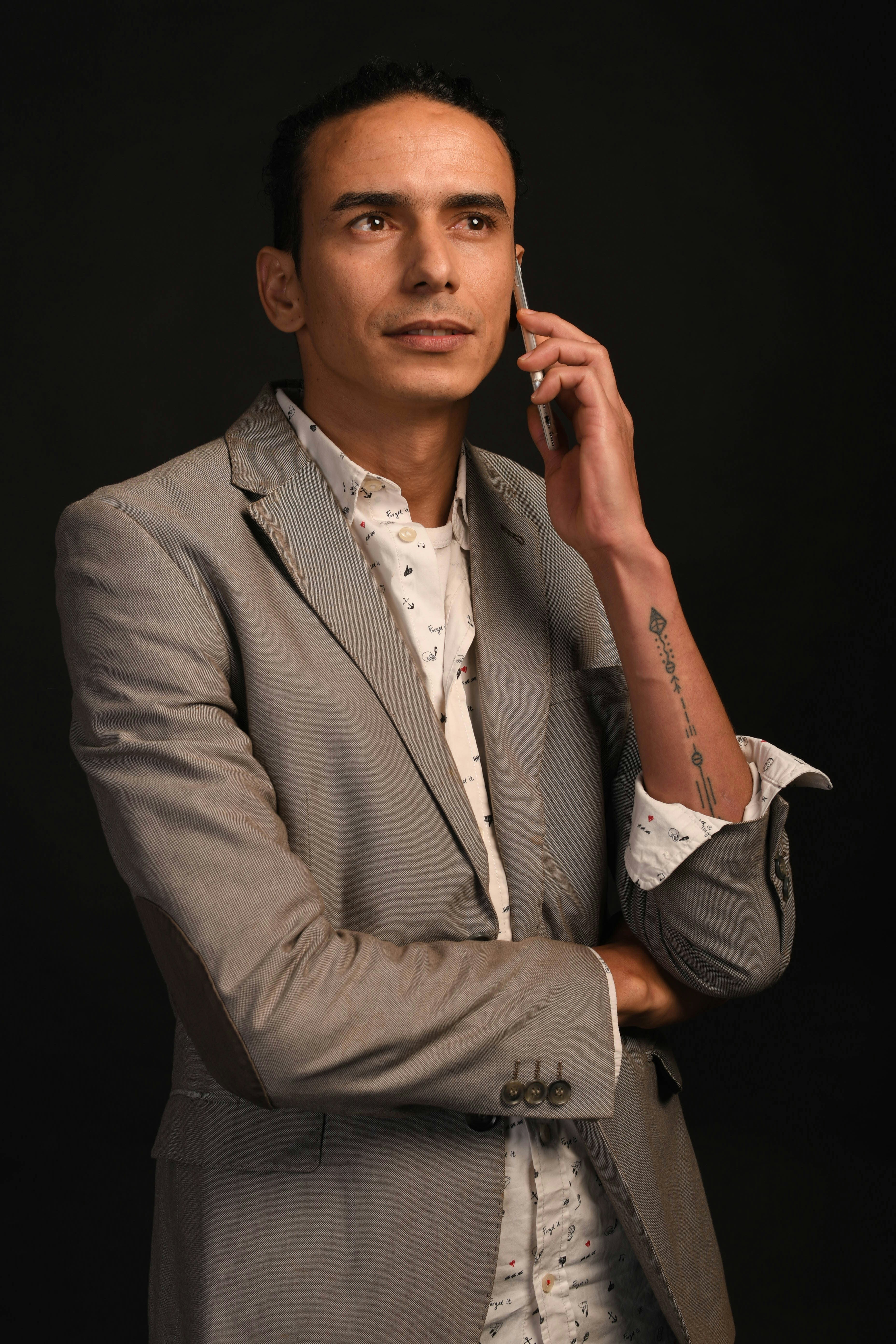 On the Line: A poised studio portrait in a light gray blazer