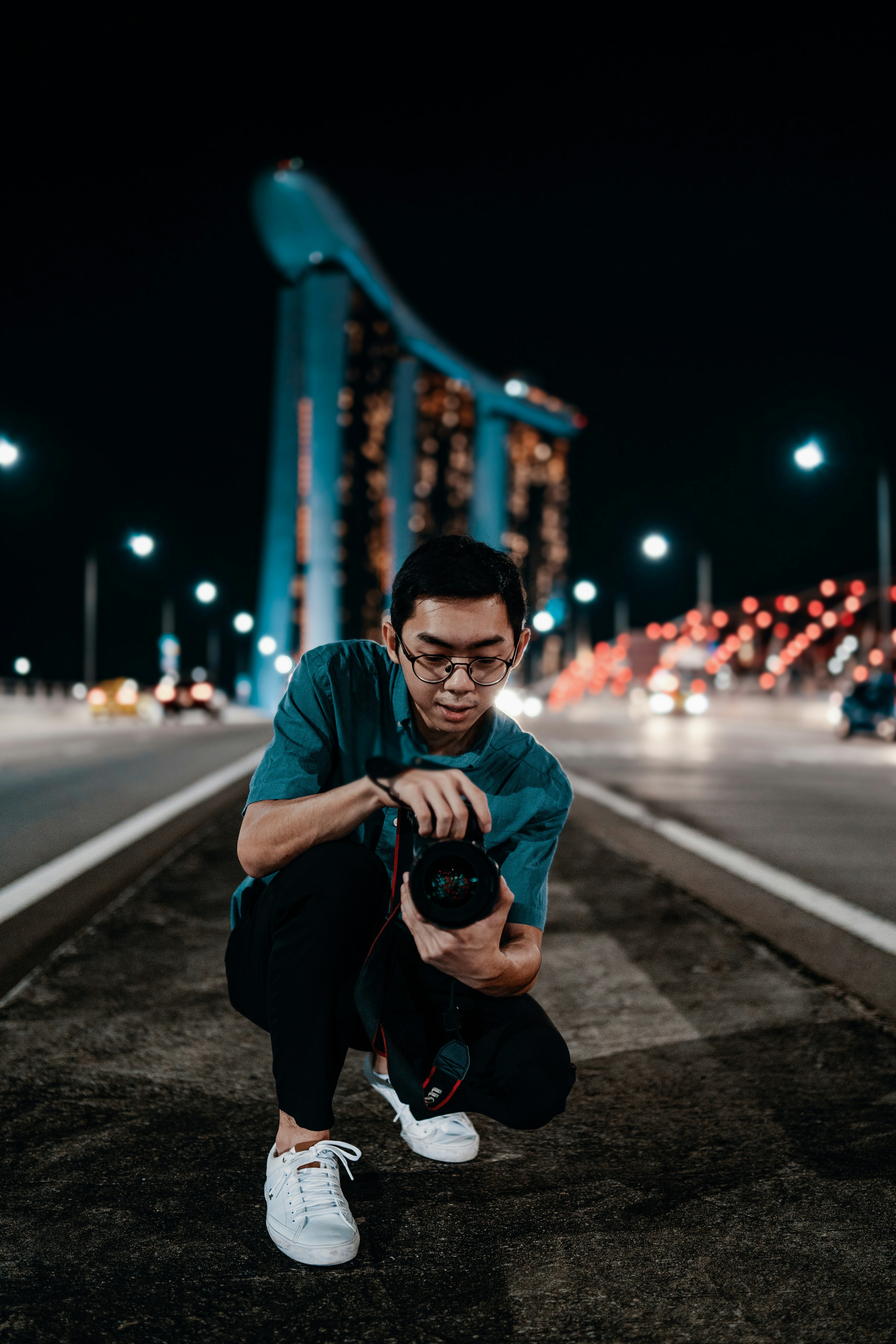 man holding camera during nighttimePang Yuhao