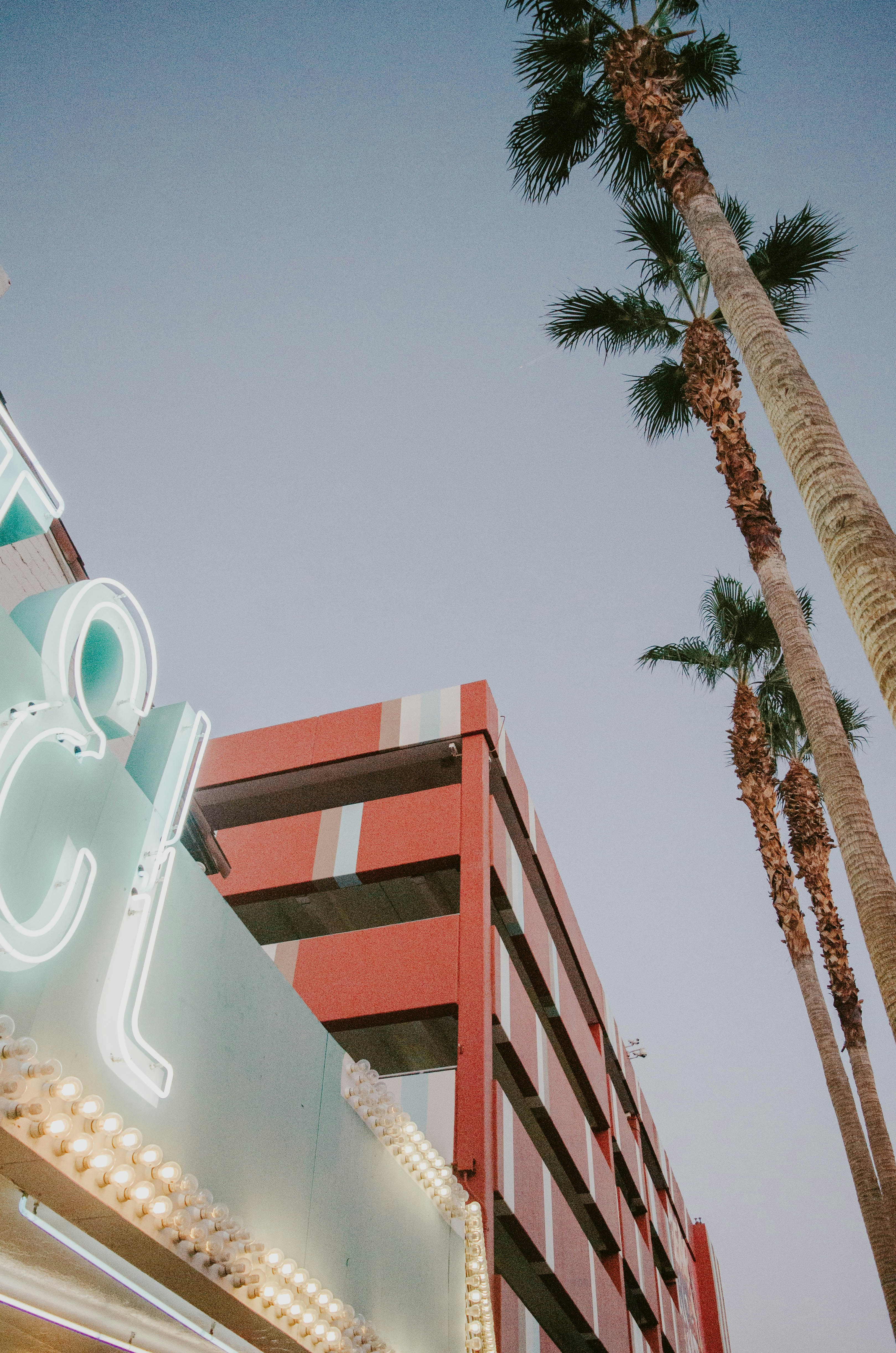 Red and white high-rise building photo – Free Plant Image on Unsplash
