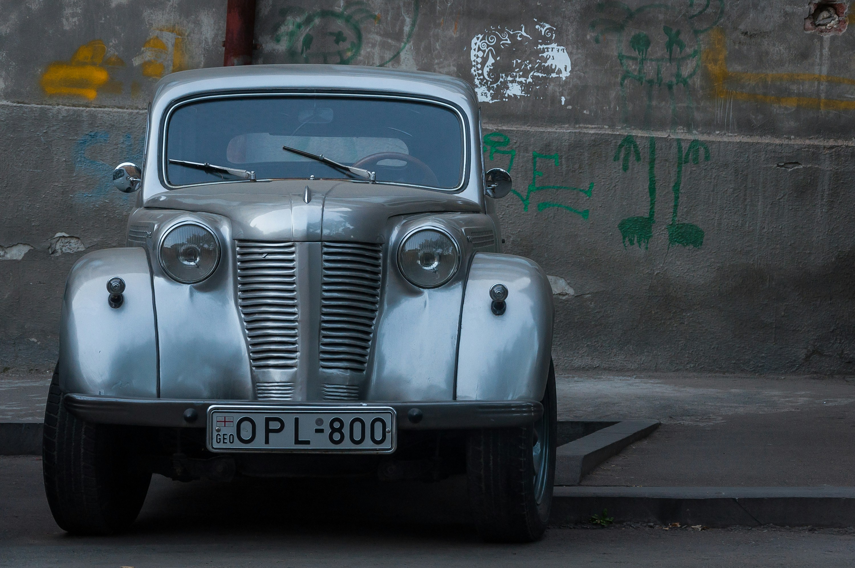 Chrome On Concrete: A Vintage Car Meets the Graffiti Wall