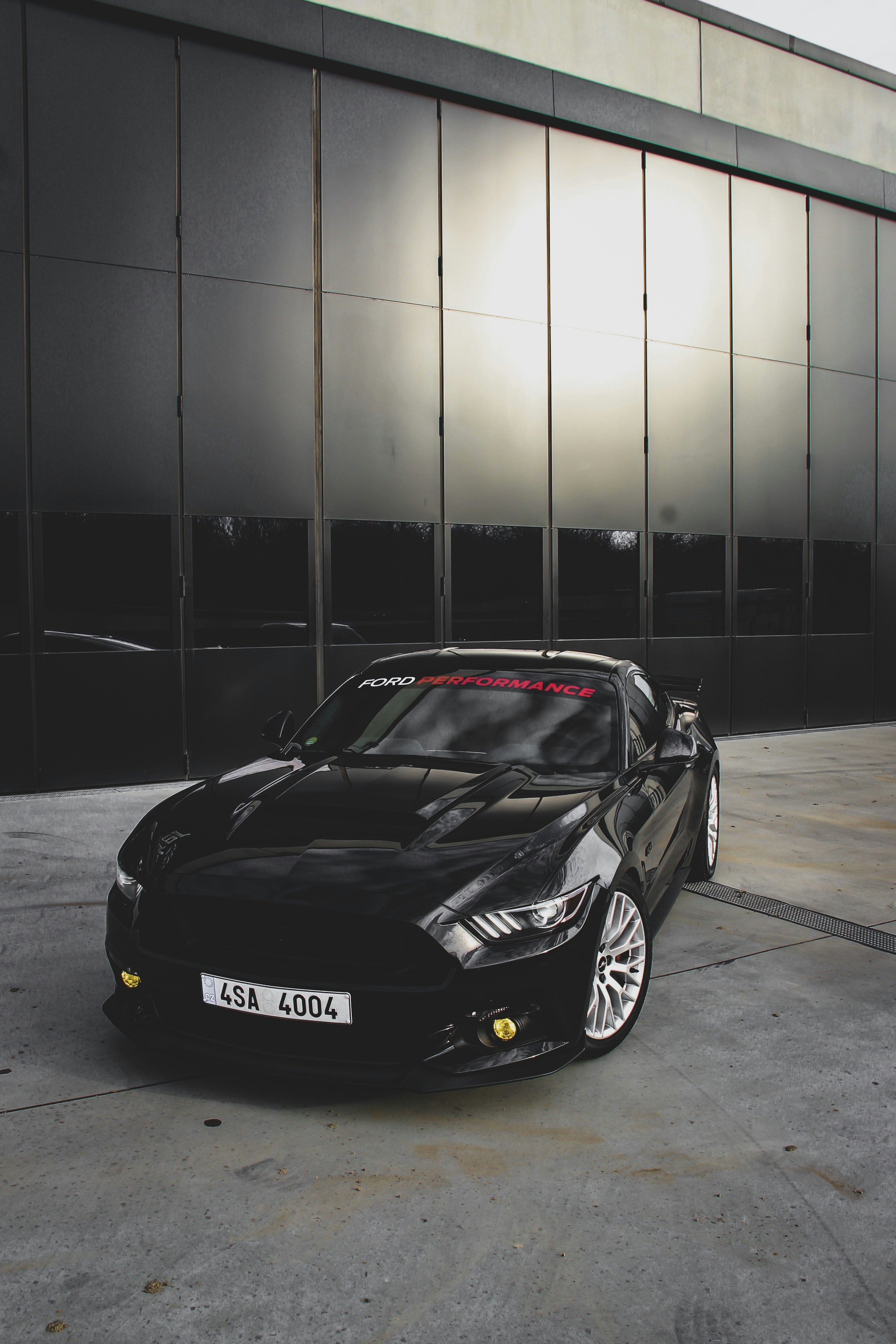 Black Ford Mustang coupe parked near green tree photo – Free Car Image ...