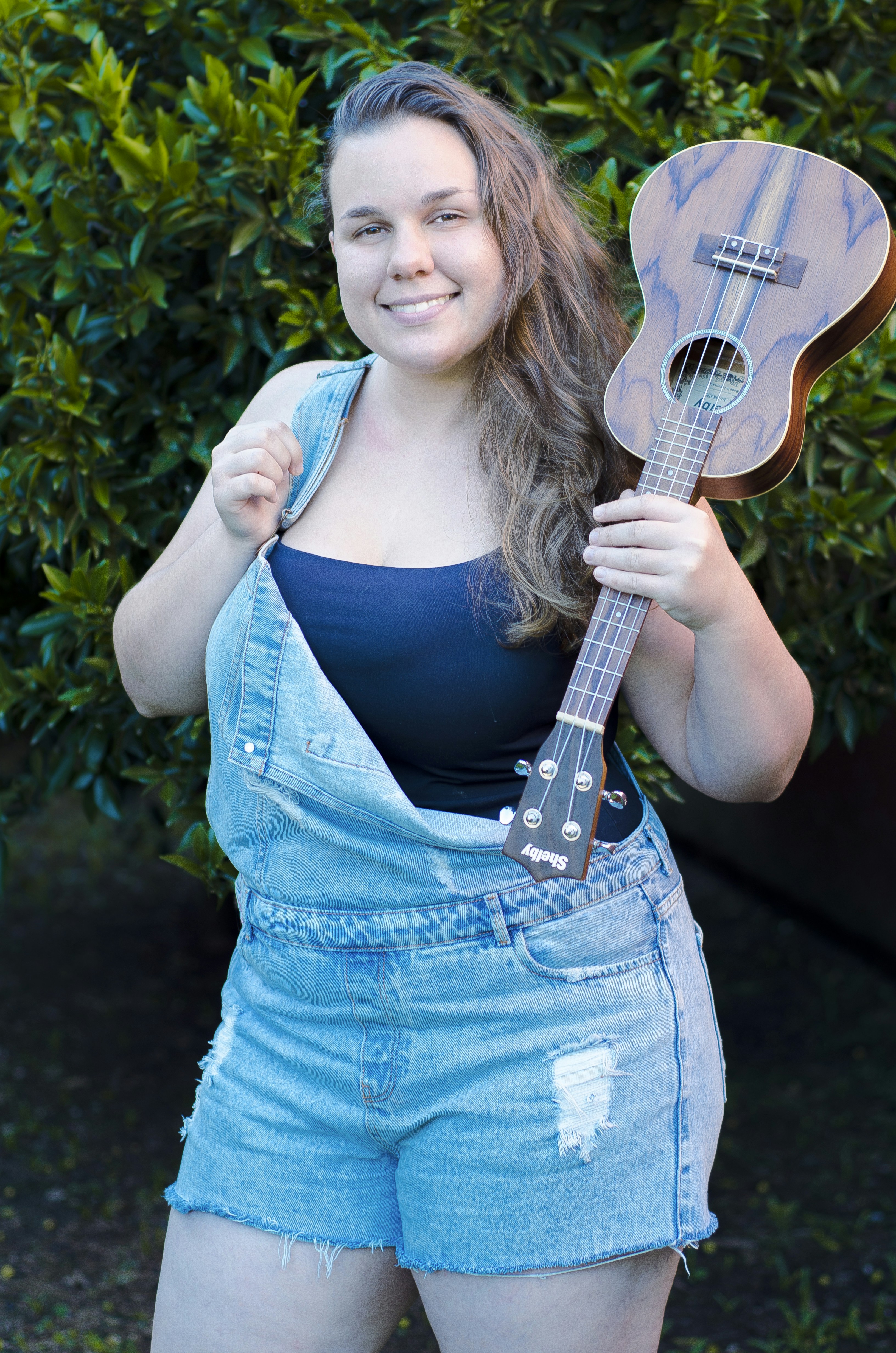 A beautiful portrait of my sister and a ukulele, using blue tones.