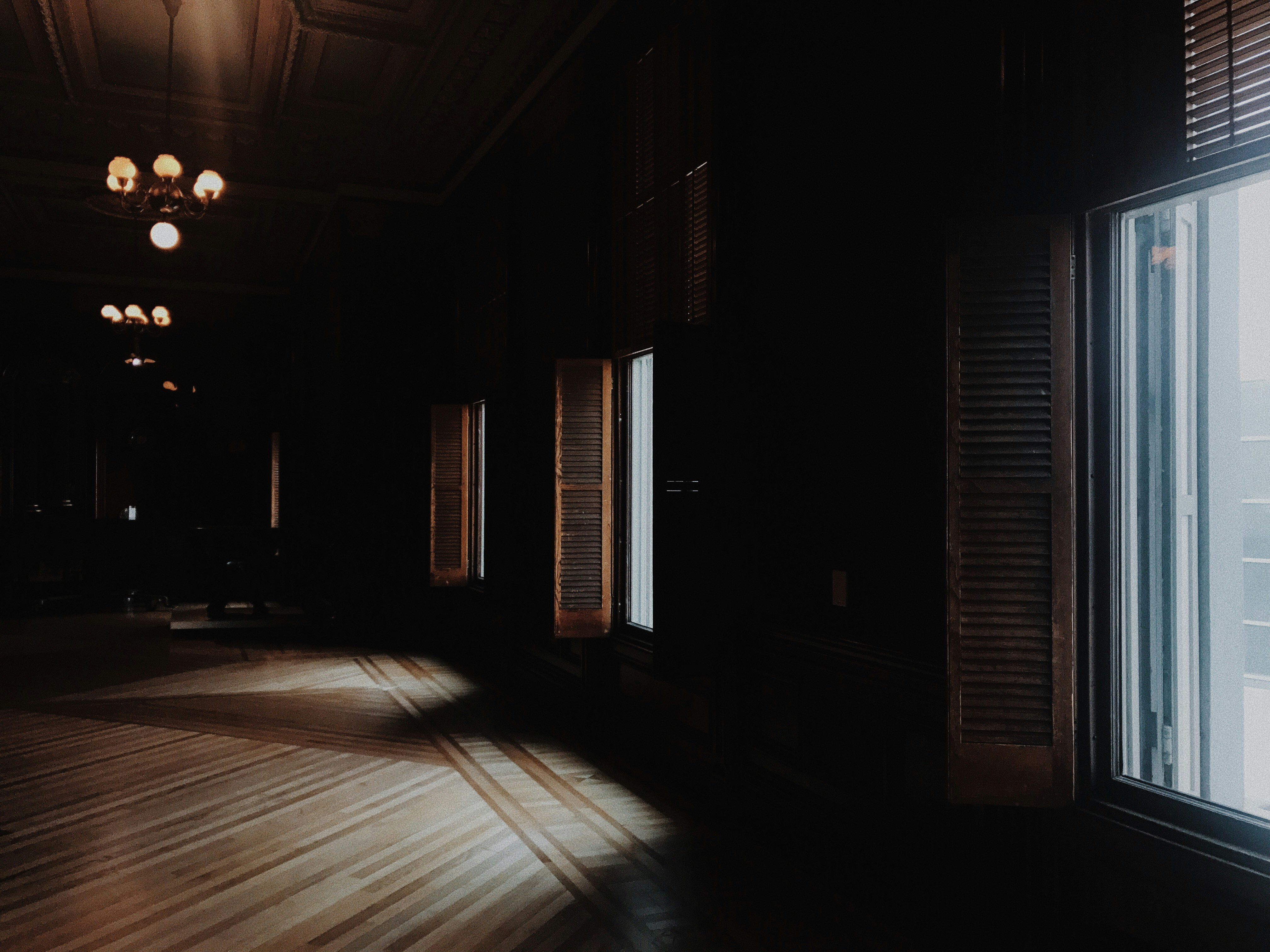 Opened brown wooden windows inside dimmed room photo – Free Window ...