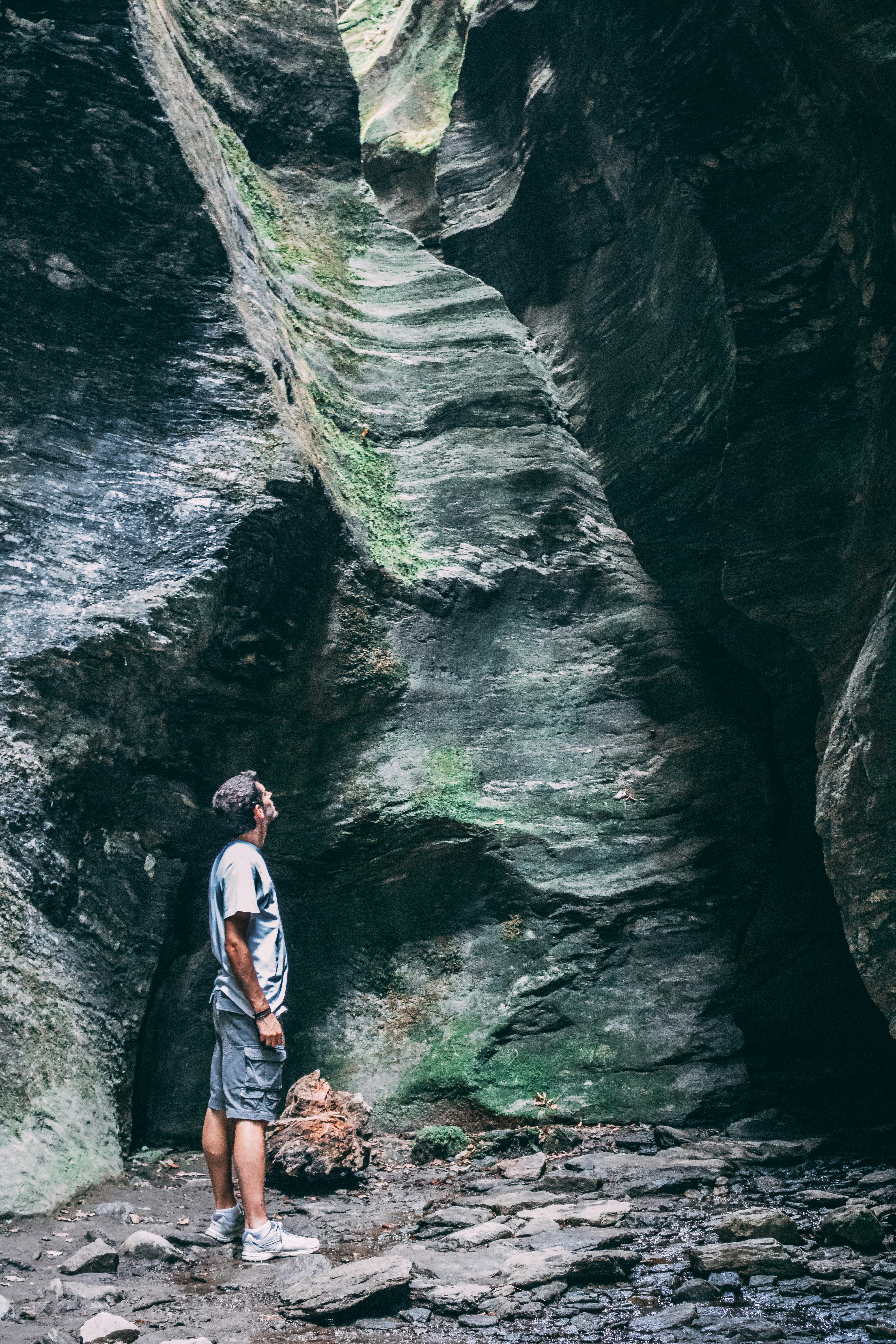 Man standing while looking on rock photo – Free Nature Image on Unsplash