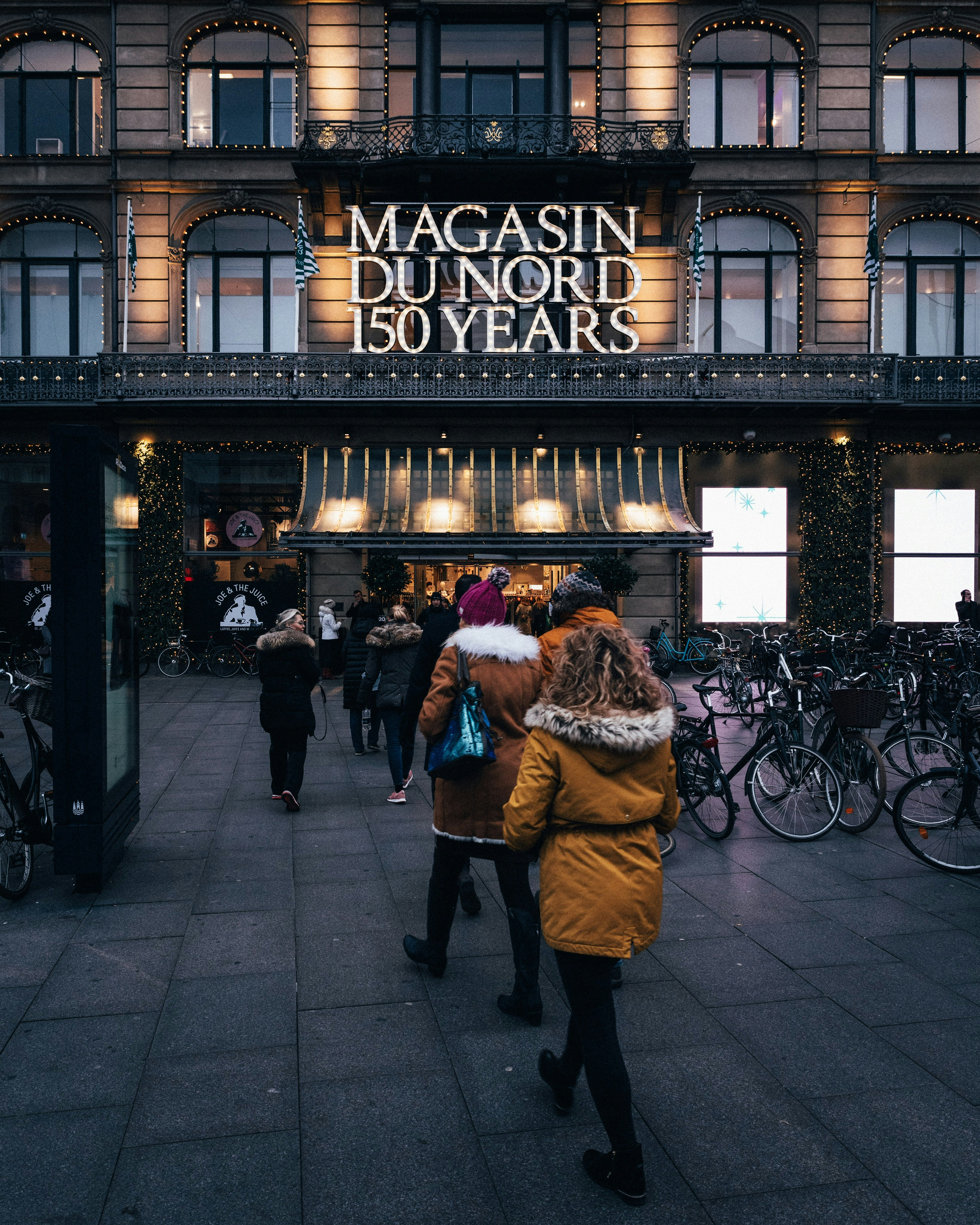 People walking towards Magasin Du Nord 150 Years photo – Free ...