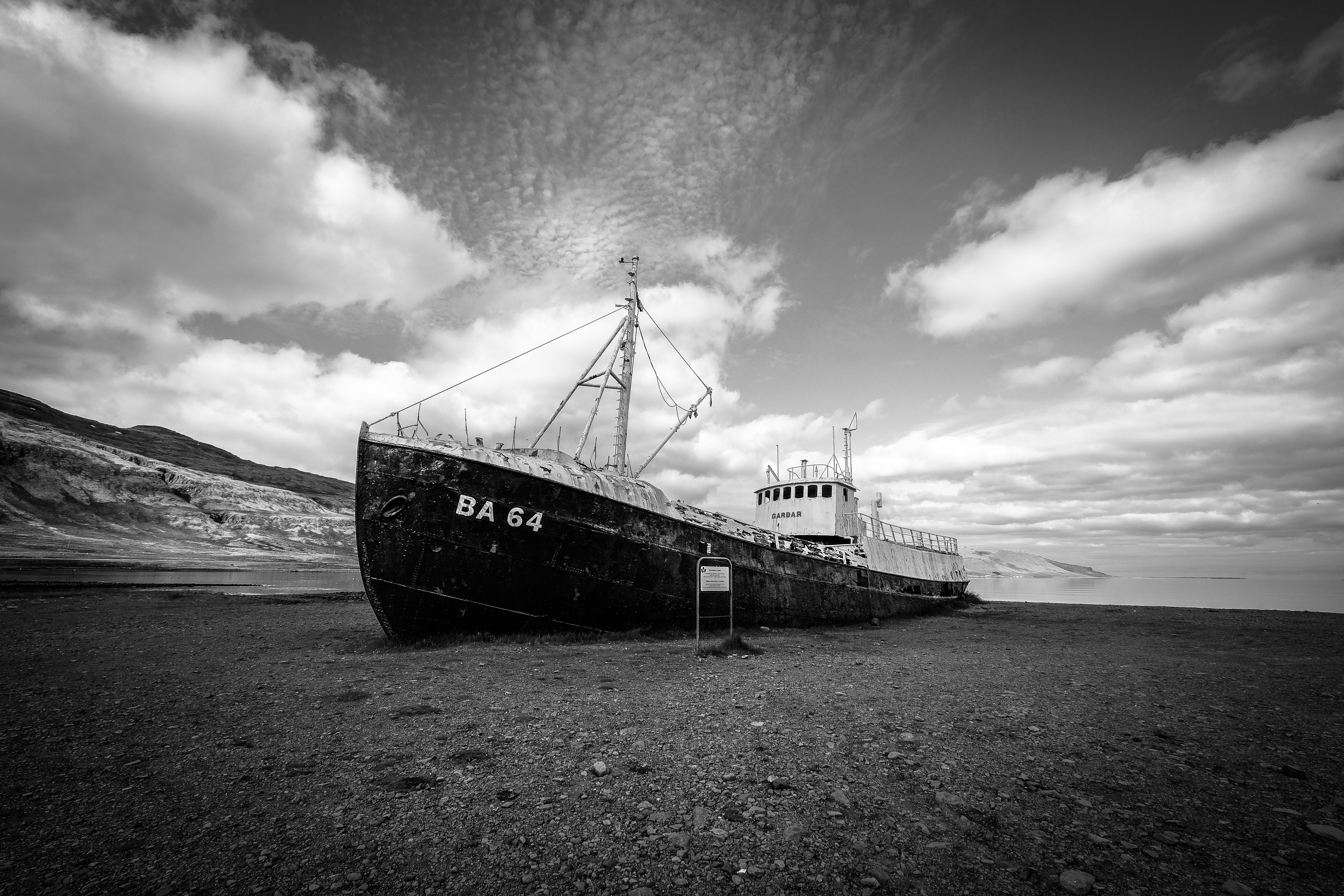 A Deserted Vessel Resting on a Shallow Shore