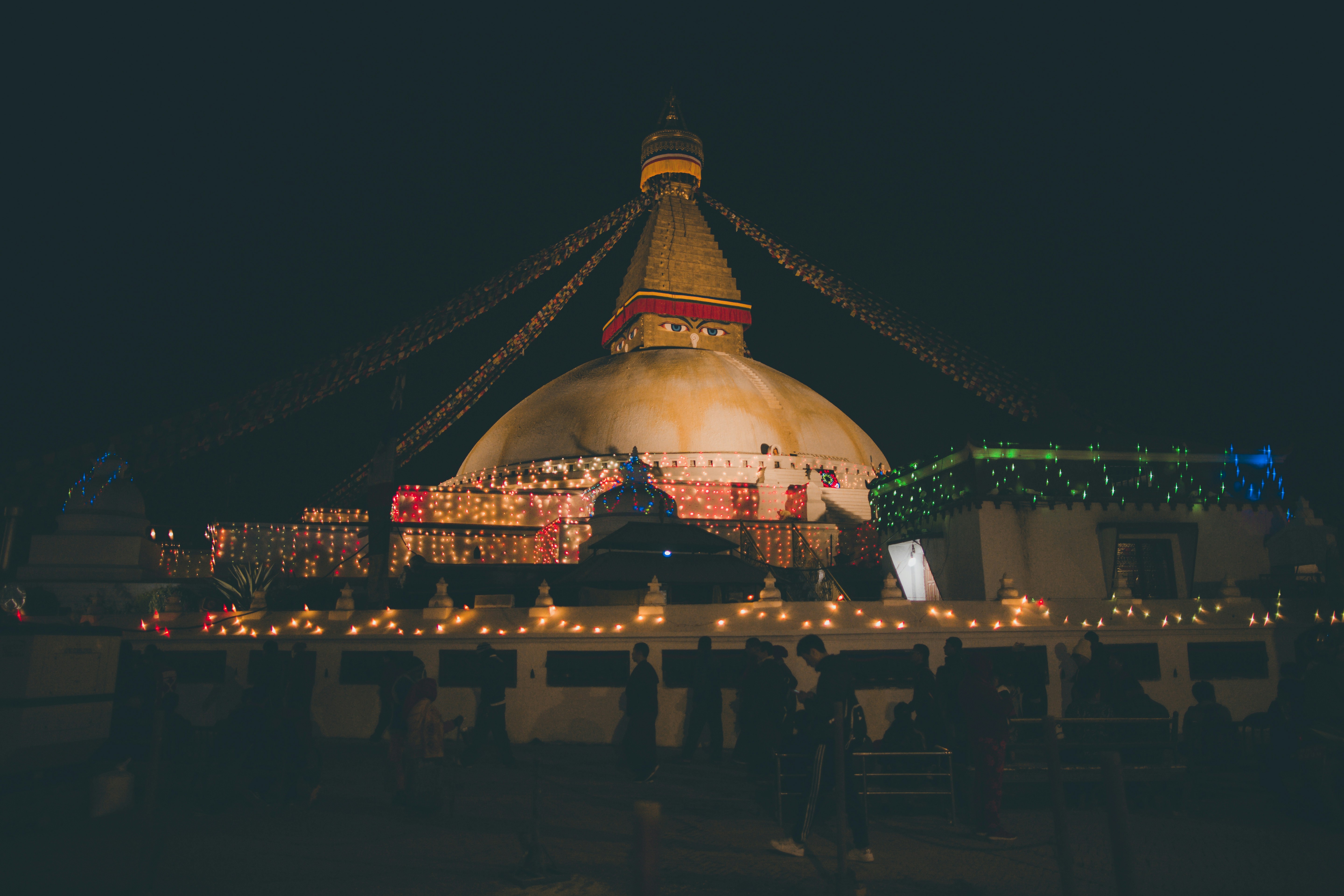 Night-Lit Stupa: Lanterns, Flags, and Silent Spectators