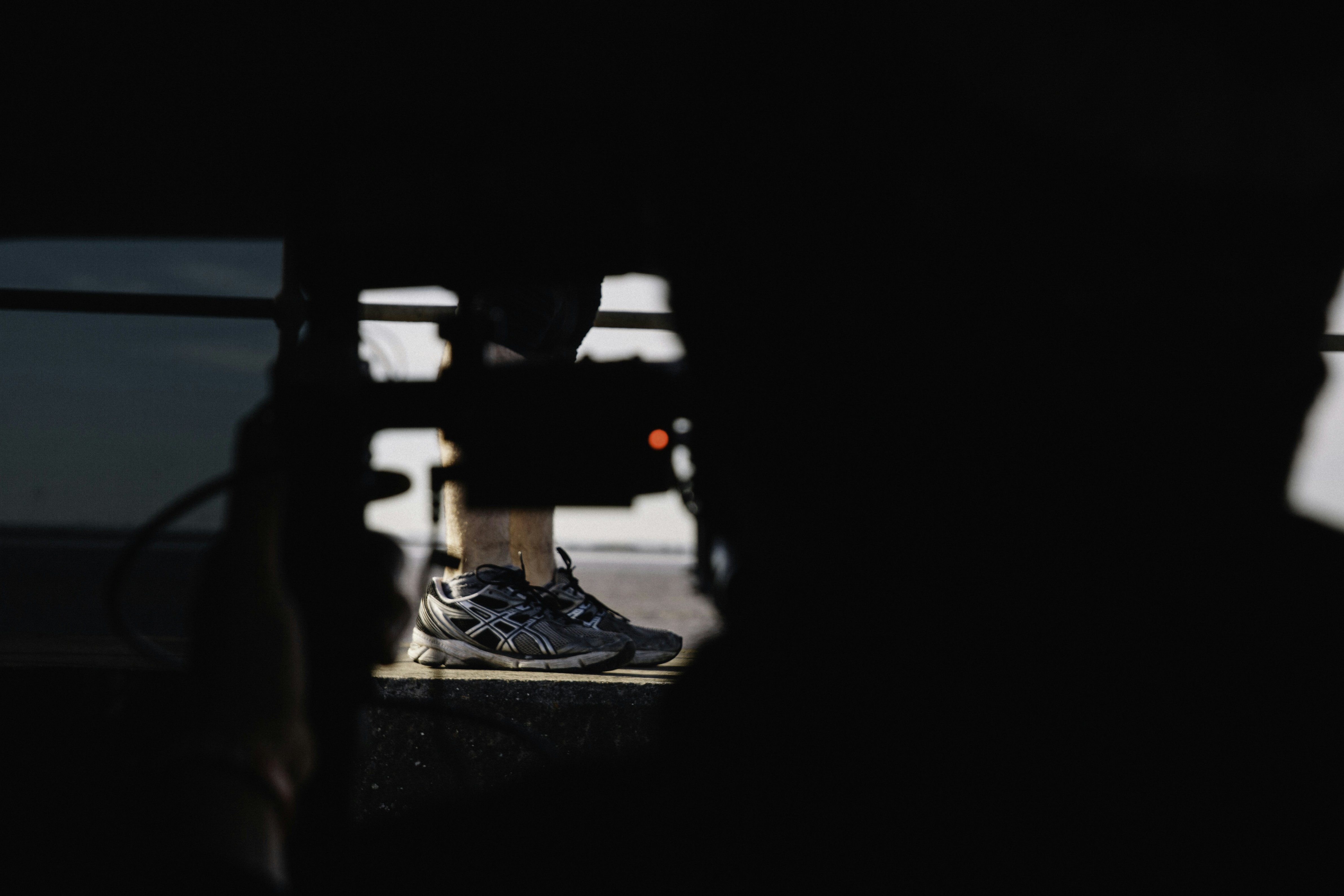 man in black Asics shoes