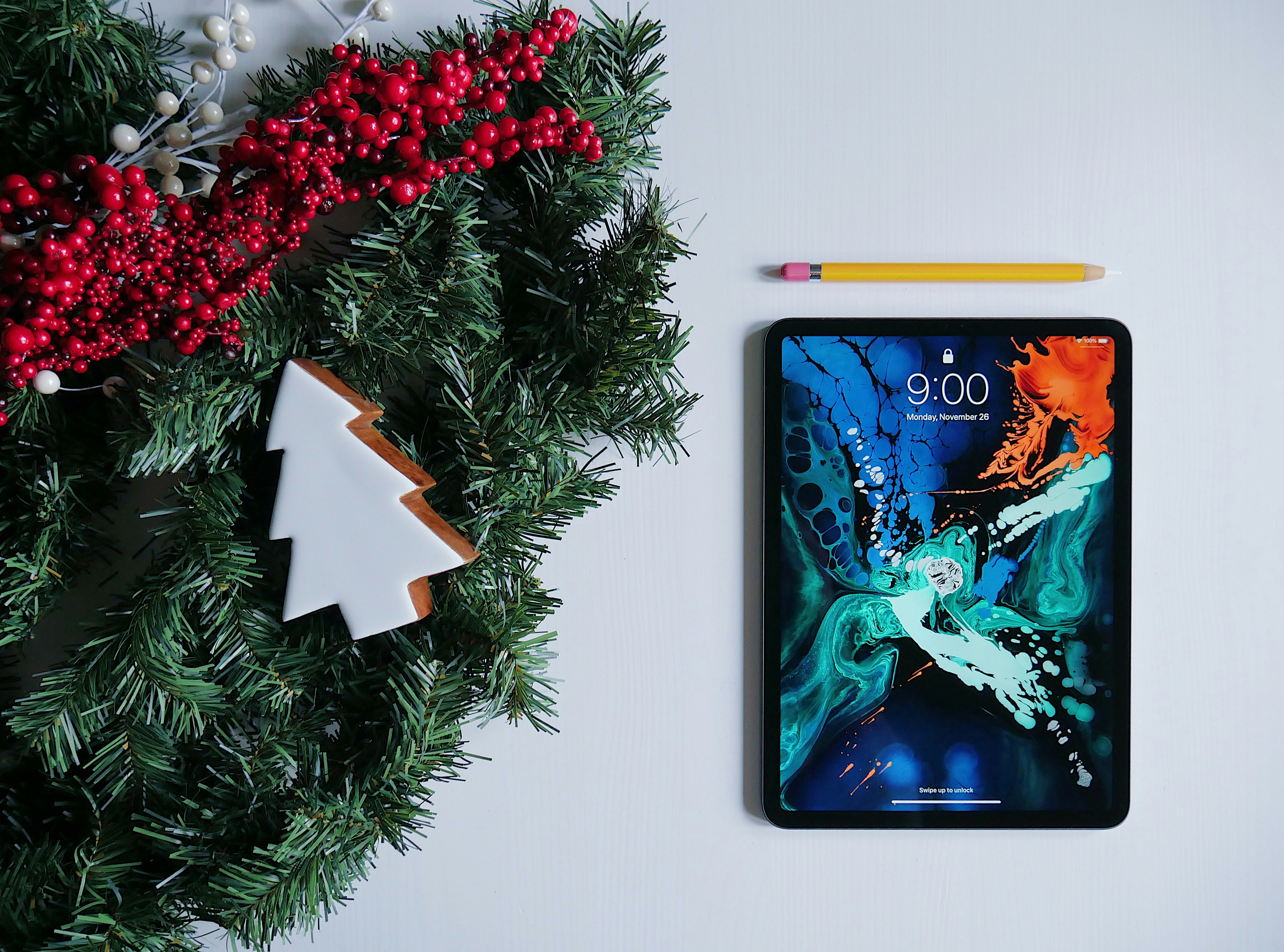 Black iPad on table with pencil photo – Free Christmas Image on Unsplash