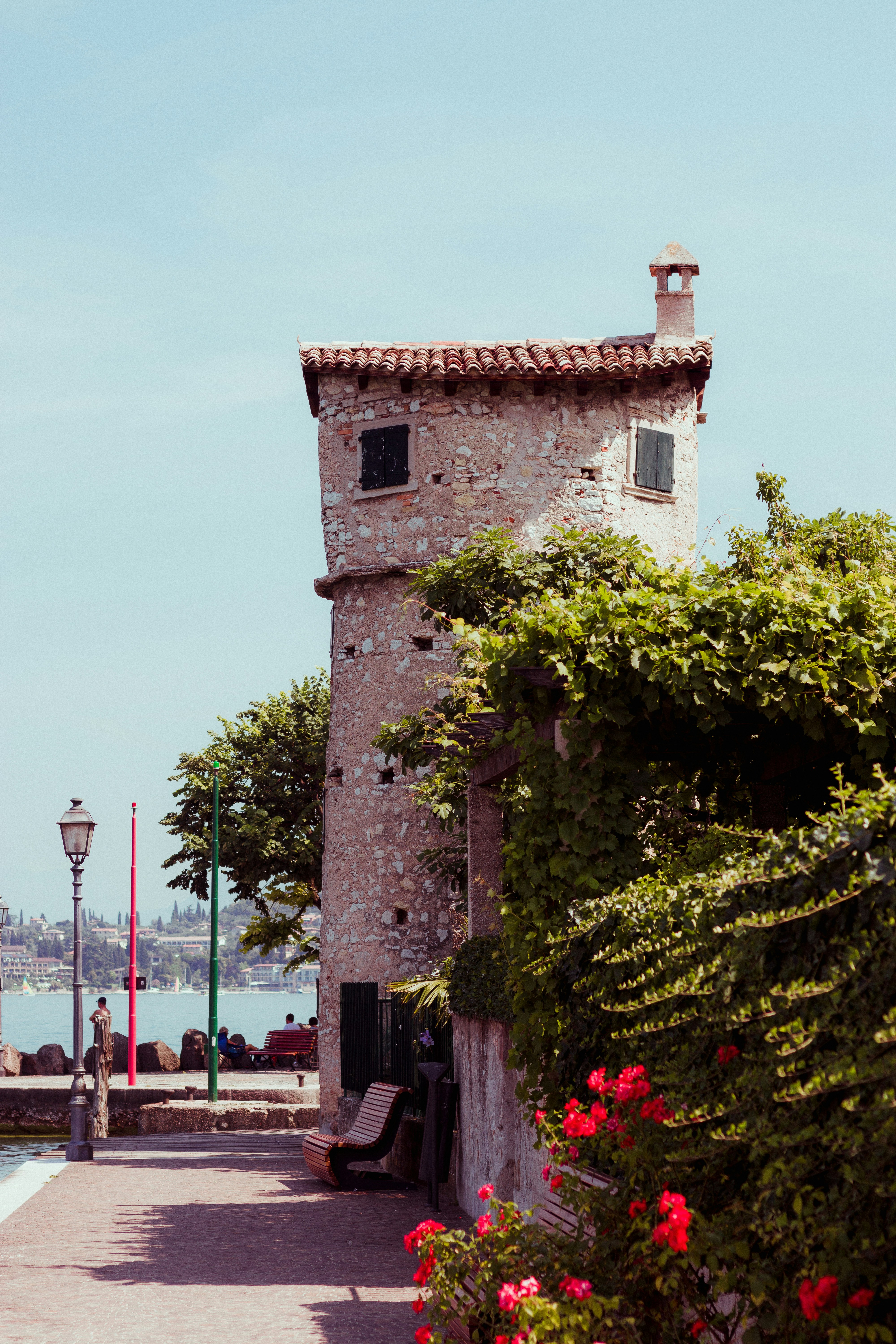 Grey tower building at the harbor photo – Free Flower Image on Unsplash