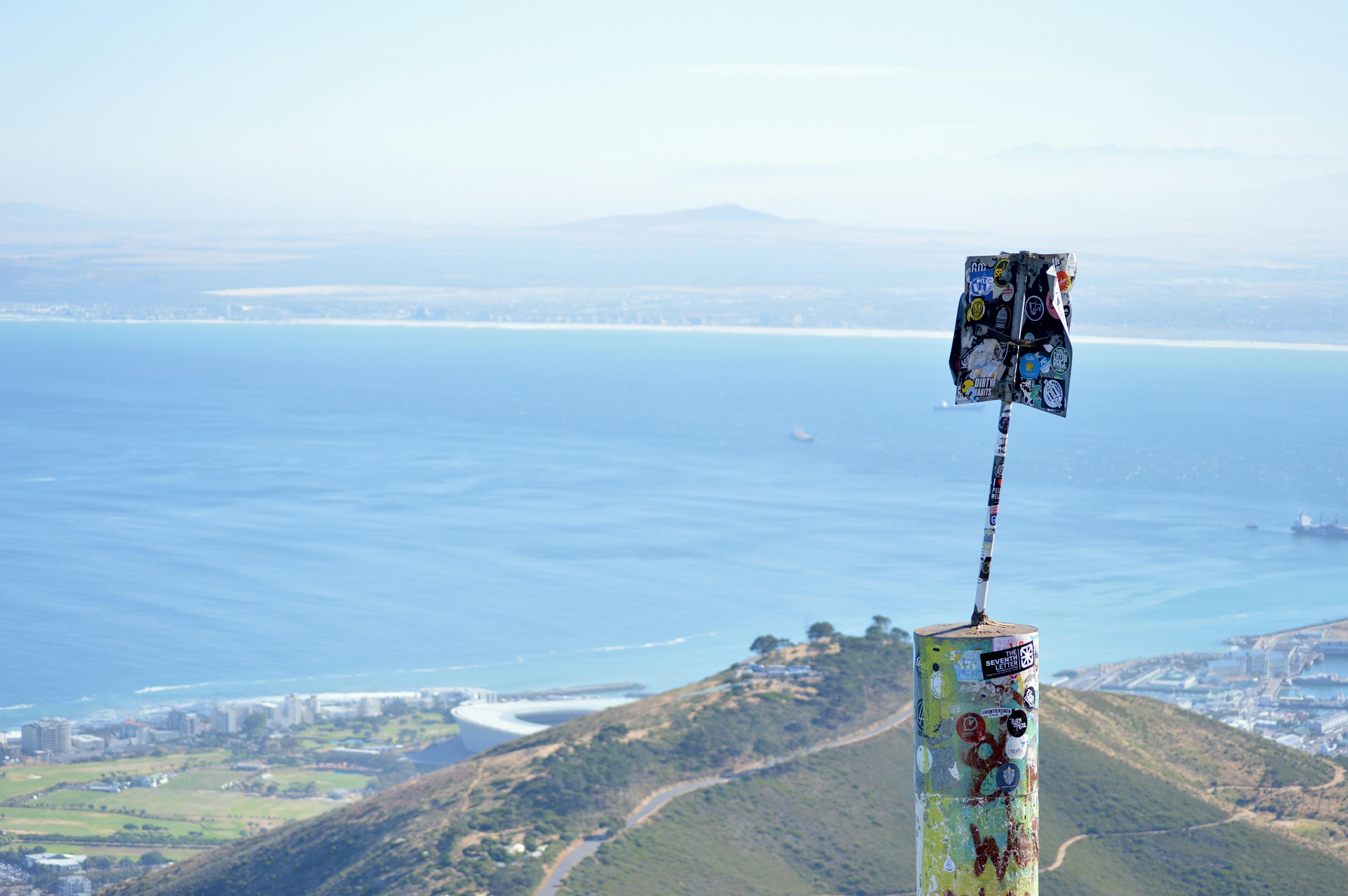 Hilltop Graffiti Banner Framing the Coastal Horizon