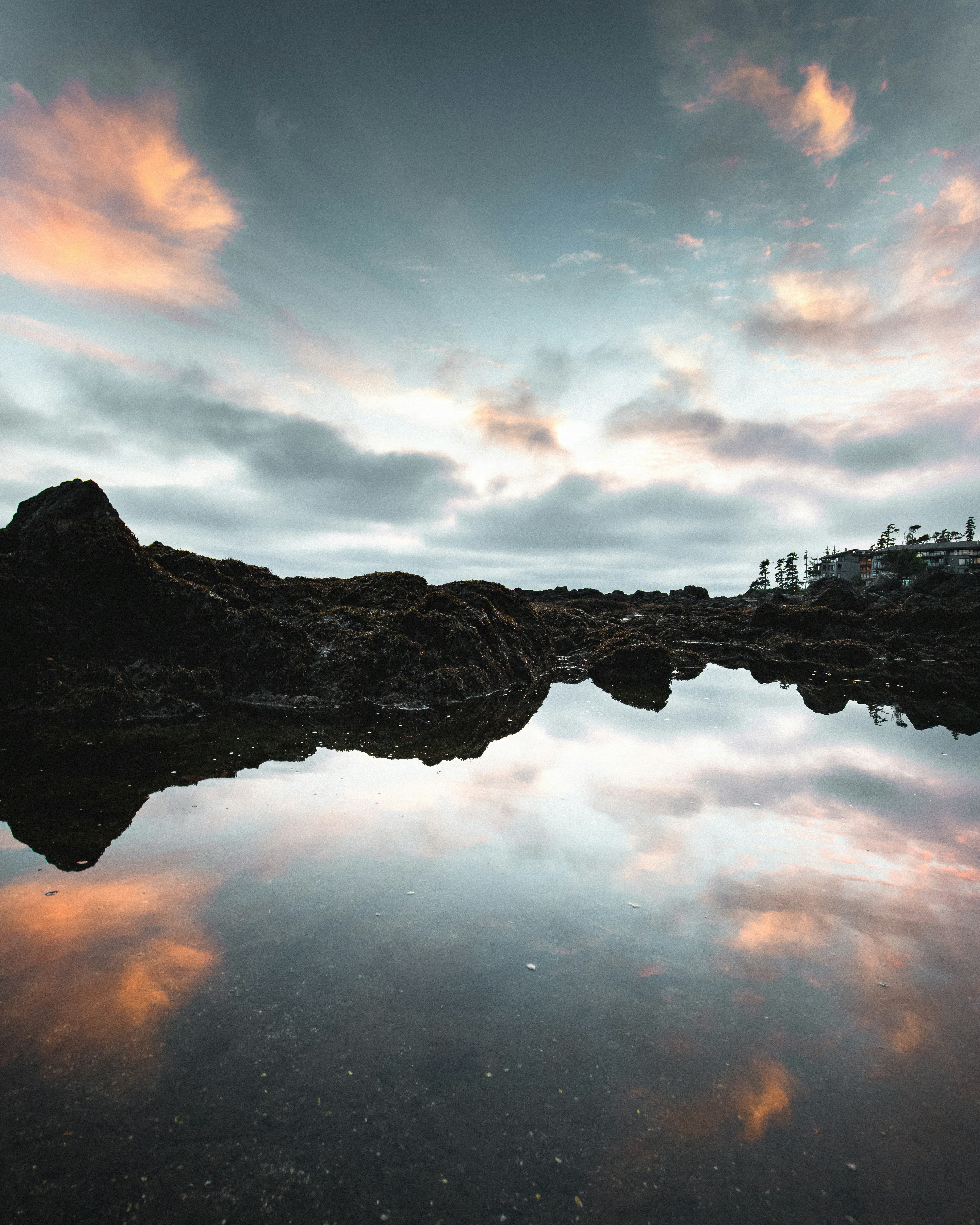 While waiting for the sun to set, I noticed the stillness of the aquatic surface before the thrashing of the tides came sailing in. In this moment, the reflecting prowess of hydrophilicity and the motion of photons were arranged such that it revealed a parallel space