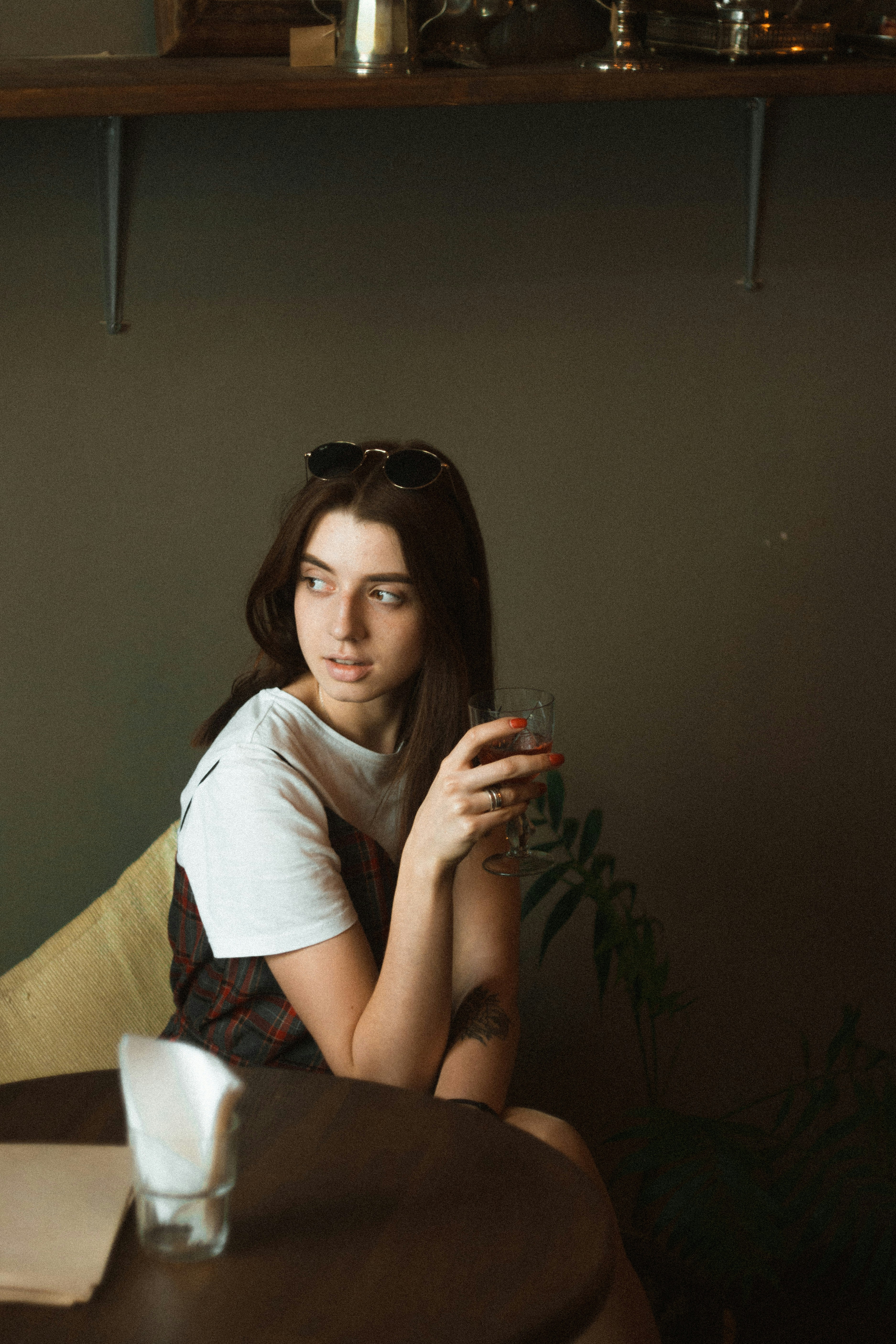 Quiet Confidence in a Dim Café Corner