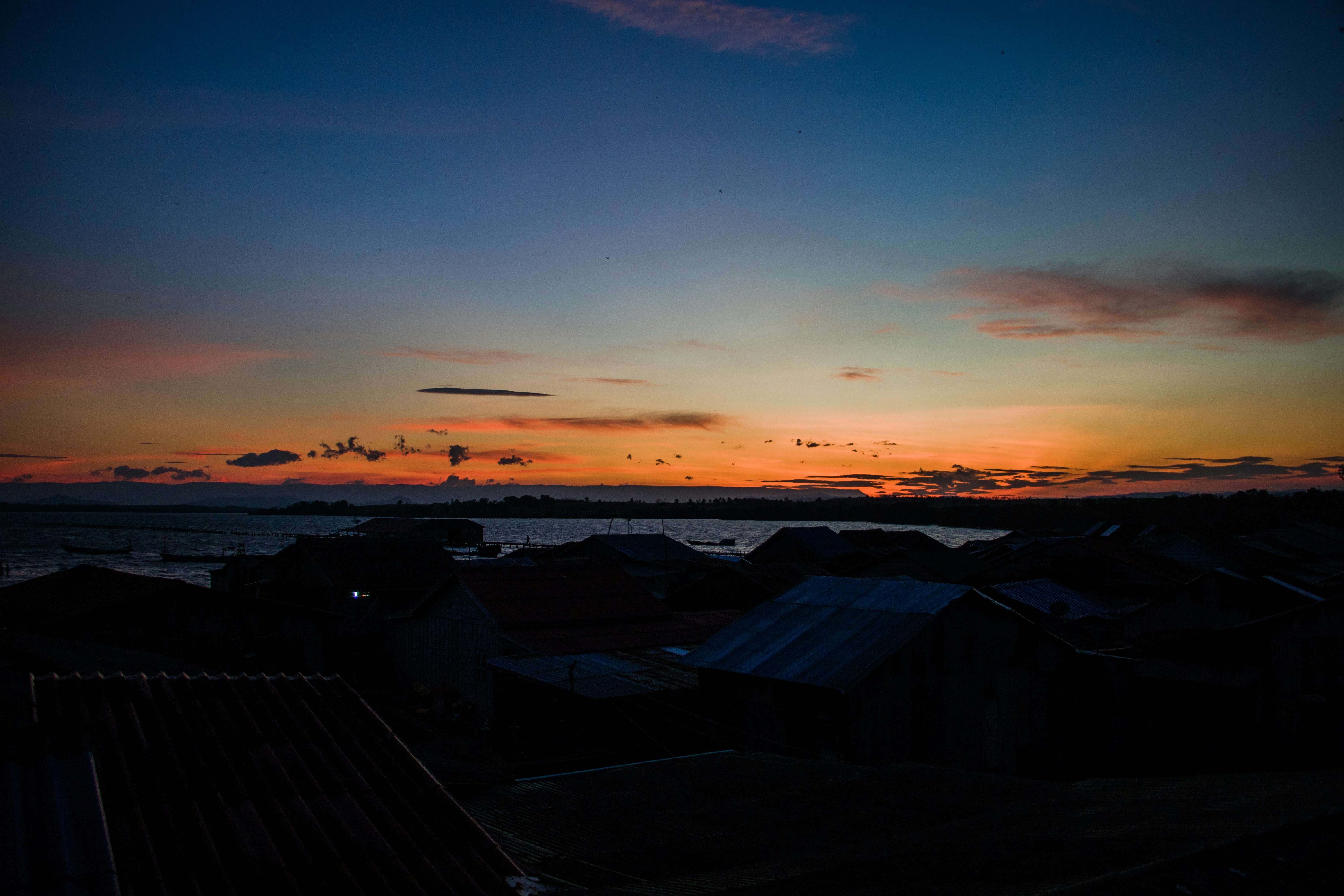 Horizon Ember Over Quiet Rooftops at Dusk