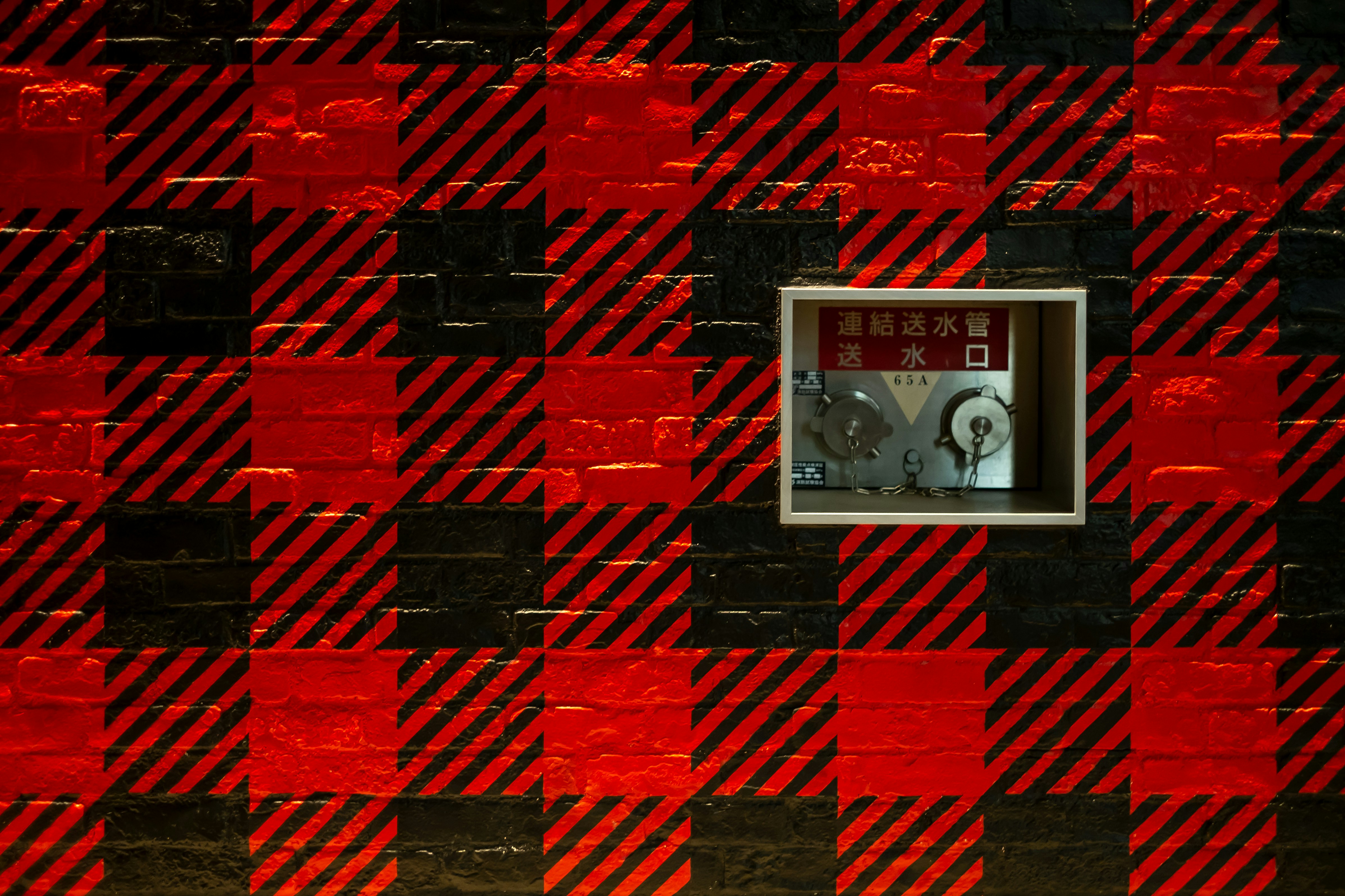 The Tiny Window in a Bold Red-Checker Wall