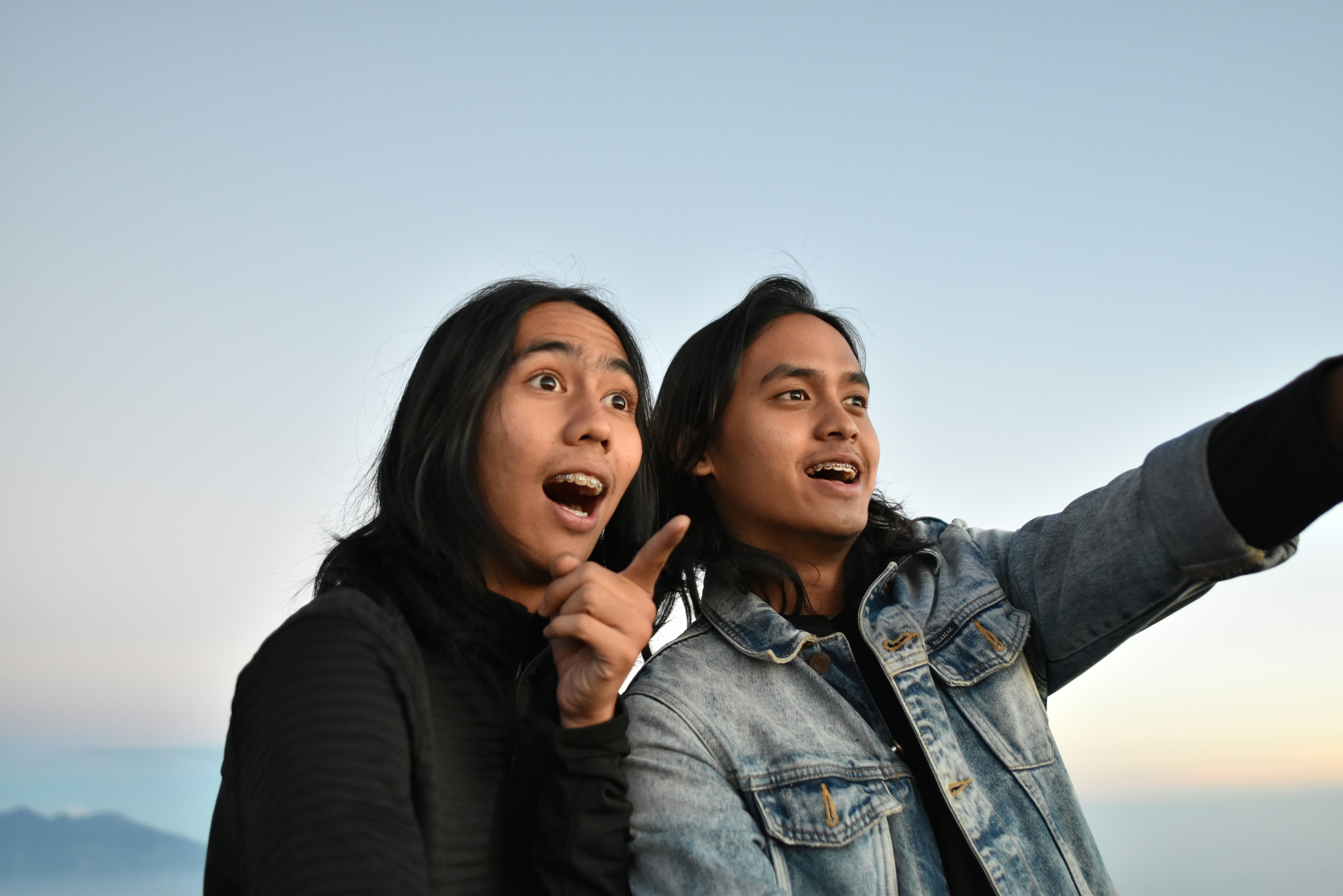 Two men pointing fingers photo – Free People Image on Unsplash