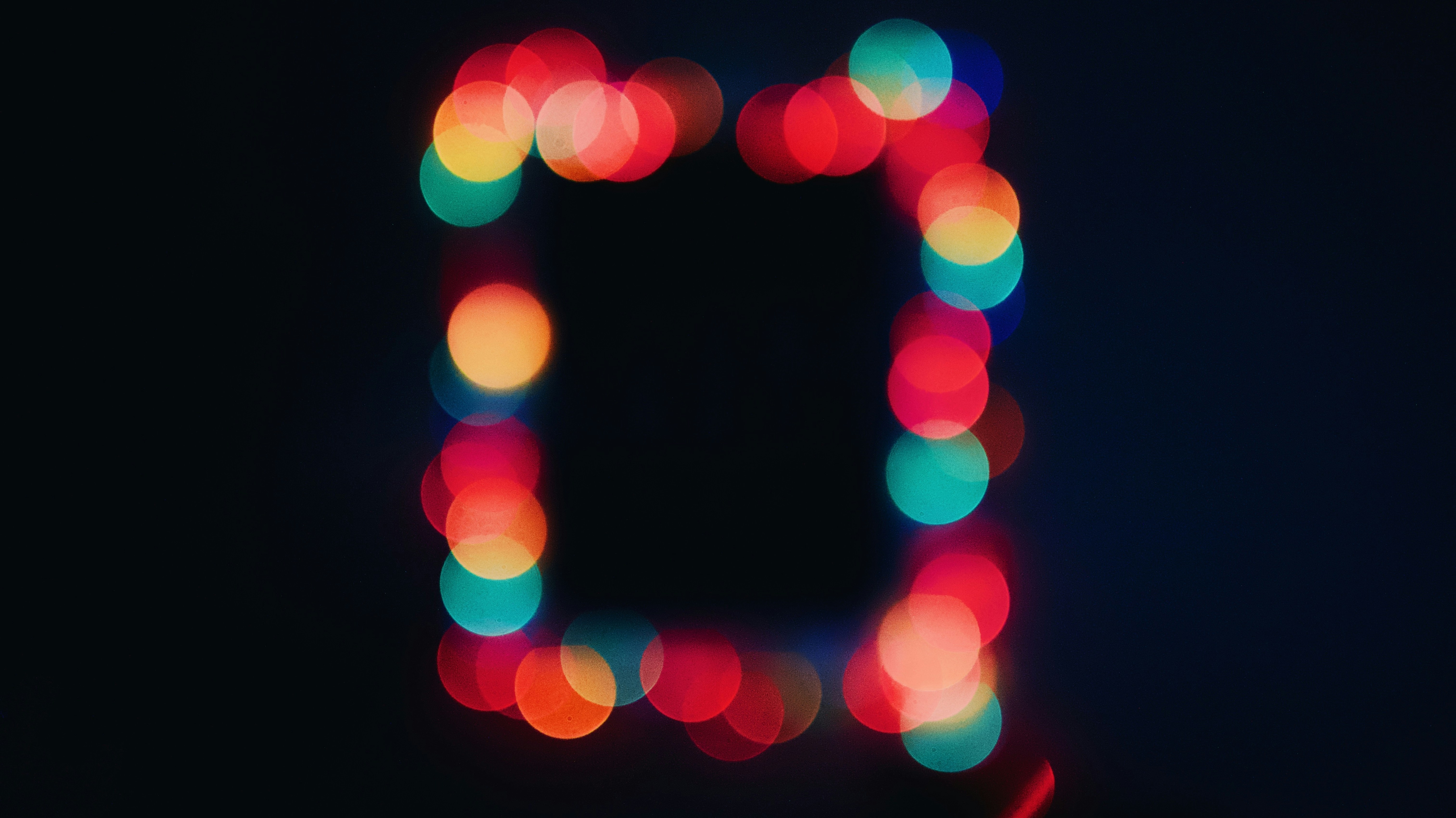 Neon-Framed Bokeh: A Vivid Ring of Lights Around a Quiet Center