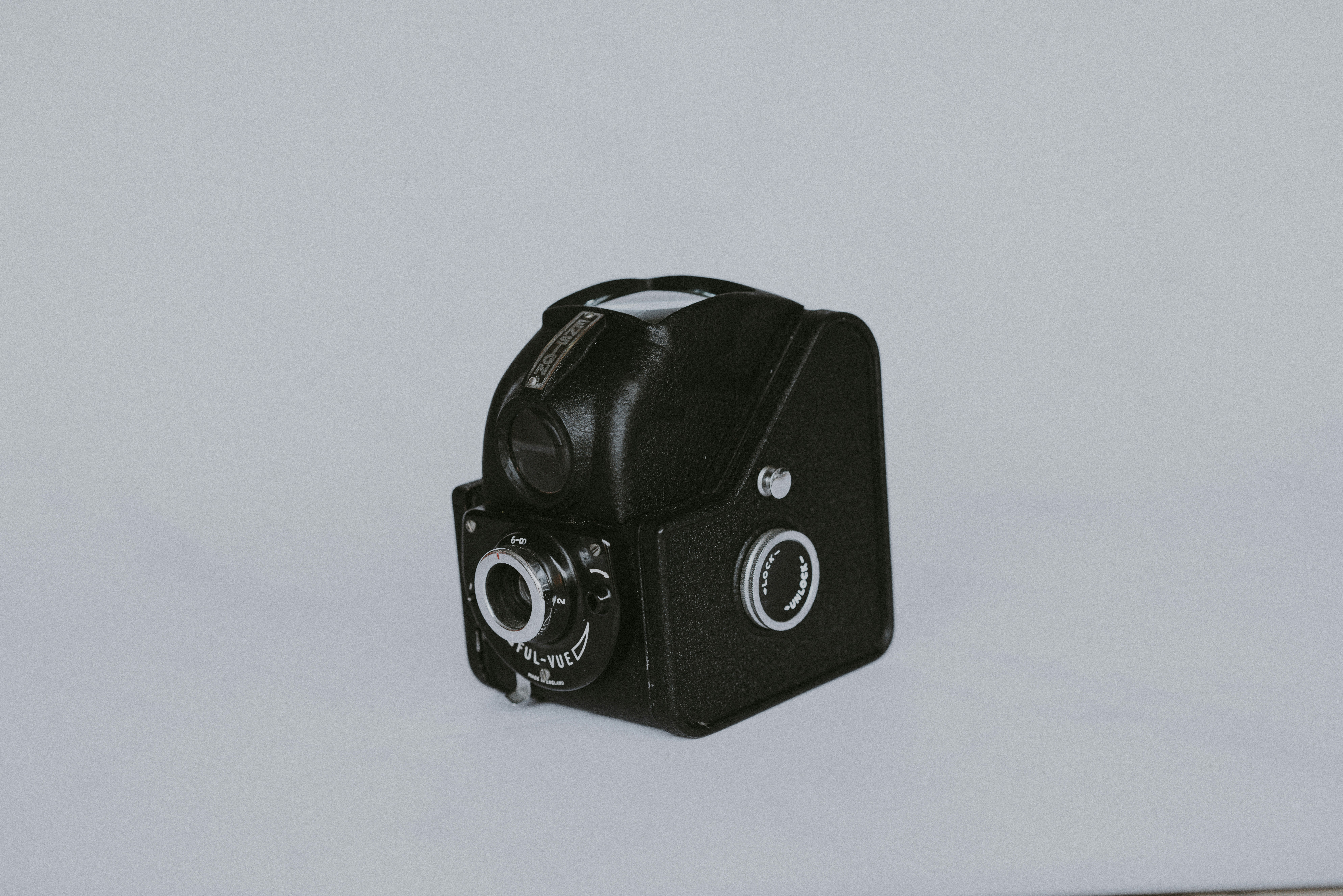 Classic medium format camera with a sleek black design, showcasing intricate details and craftsmanship.