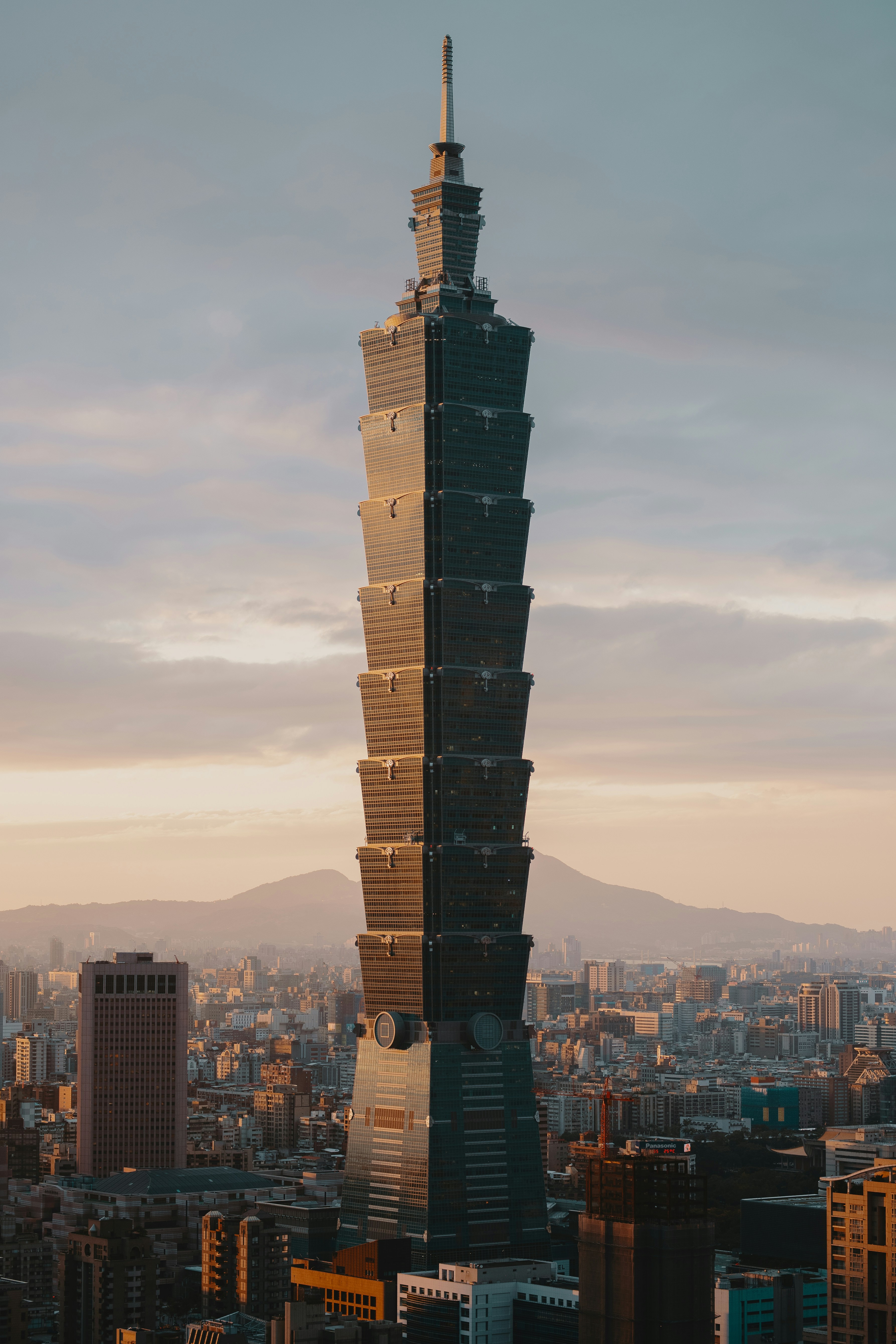Brown high-rise concrete building under gray sky photo – Free Taipei ...